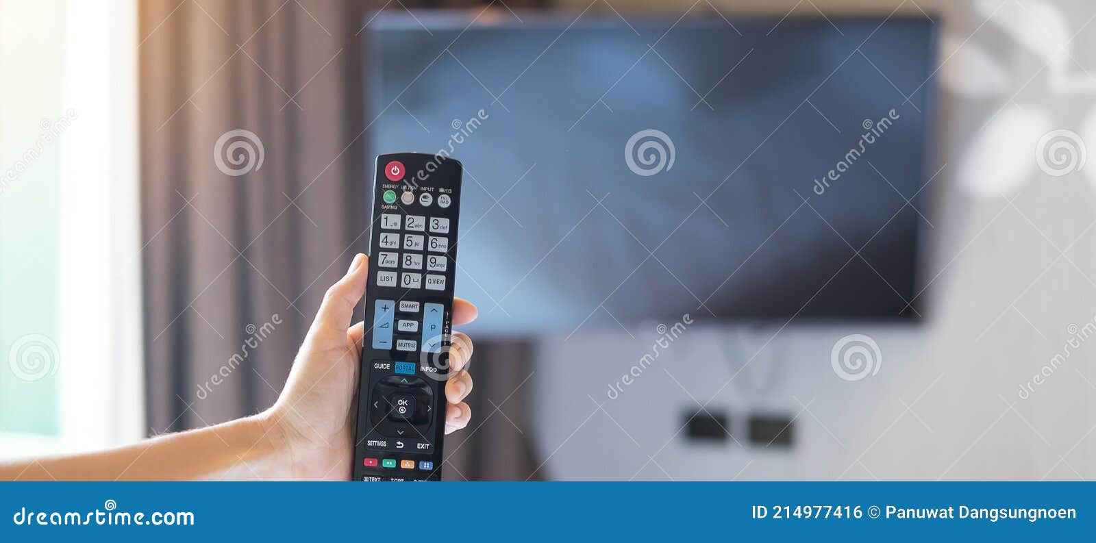 Hand Using Remote Controller for Adjust Smart TV Inside the Modern Room ...