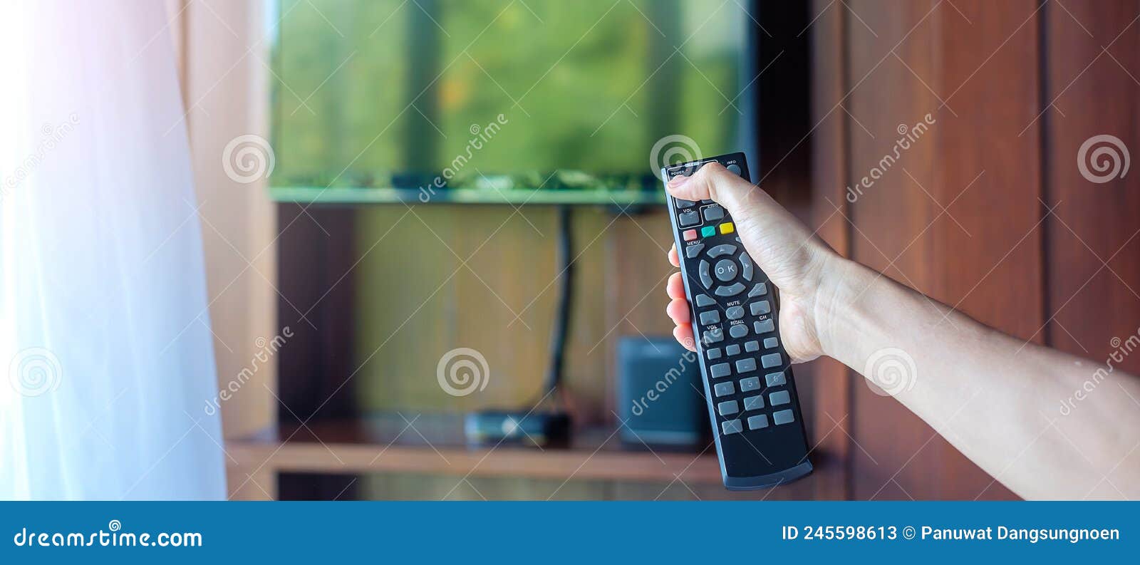 Hand Using Remote Controller for Adjust Smart TV Inside the Modern Room ...