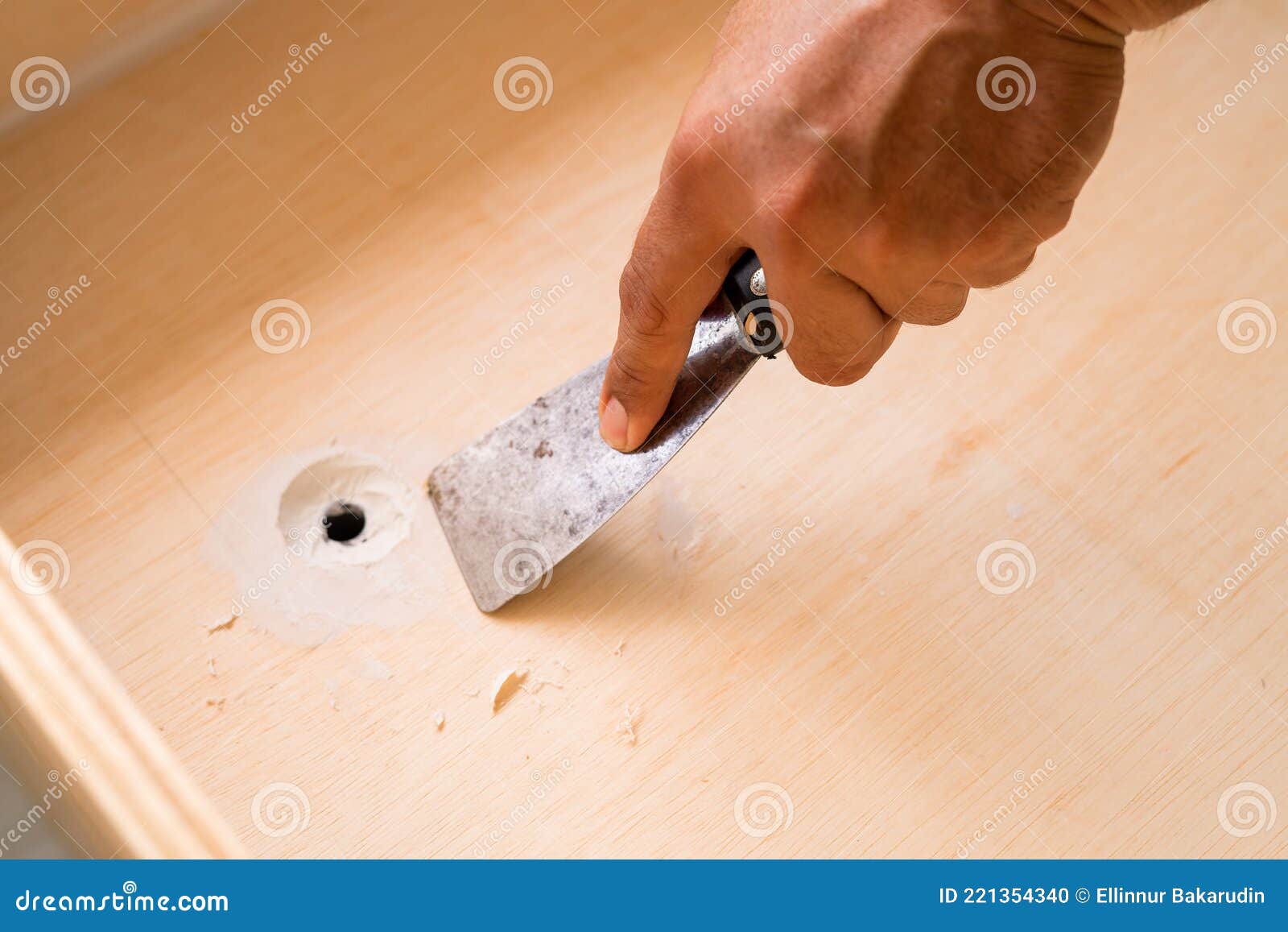 Hand Using Scraper Tool with White Paint Scraped Stock Photo - Image of ...