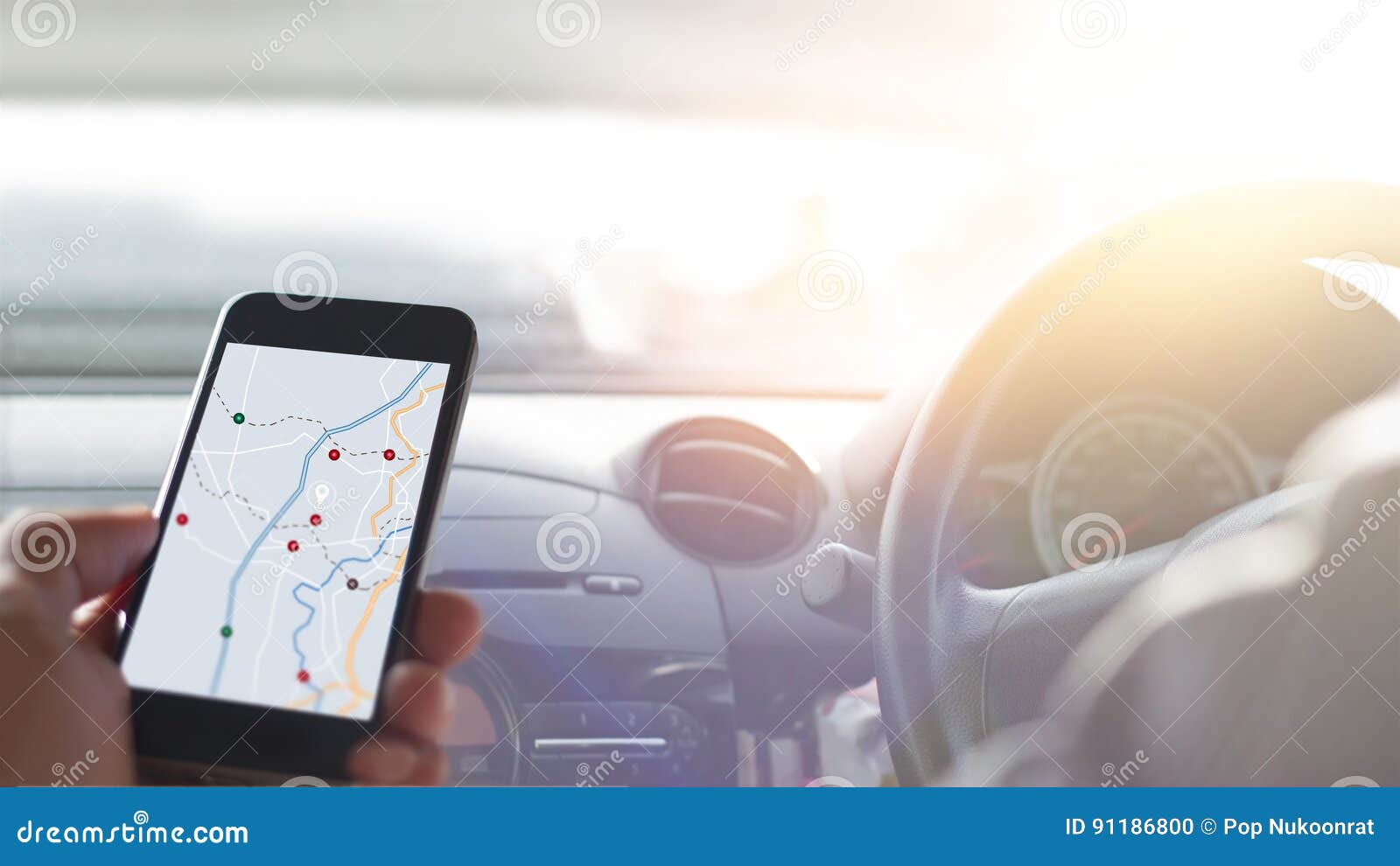 Hand Using Smartphone GPS Navigation Inside Car on the Street Stock ...