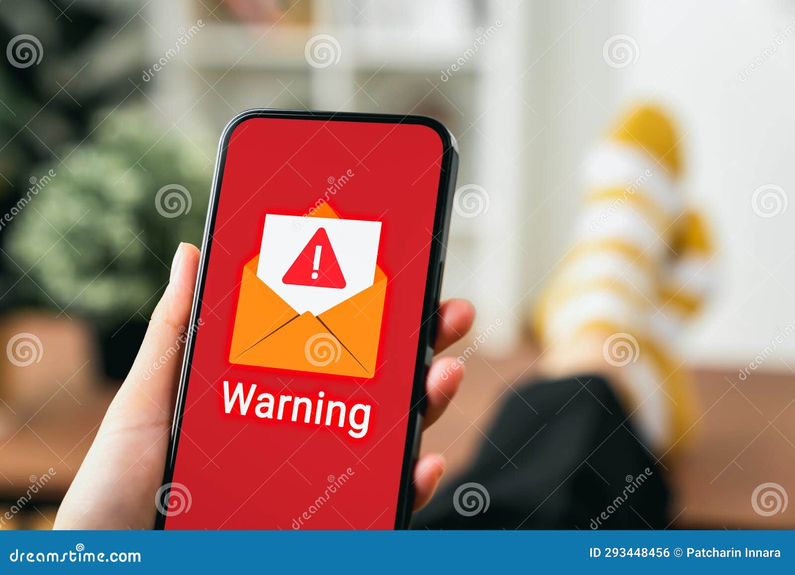 Hand Using Smartphone with Shows a Warning Screen of New Email ...