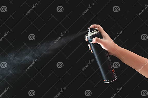 Hand Using a Spray, Isolated on Black Background Stock Photo - Image of ...