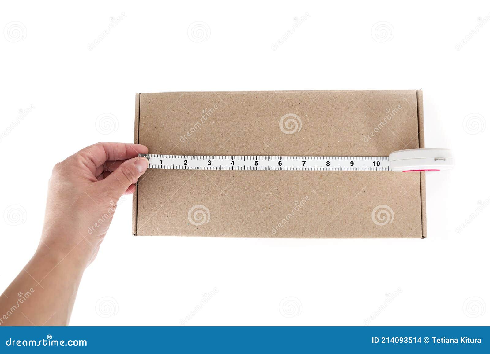 Hand Using a Tape Measure Measures a Cardboard Box Against White ...