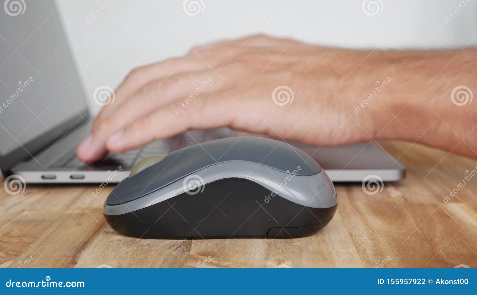 Hand Using Wireless Mouse with Laptop and Types on the Keyboard ...