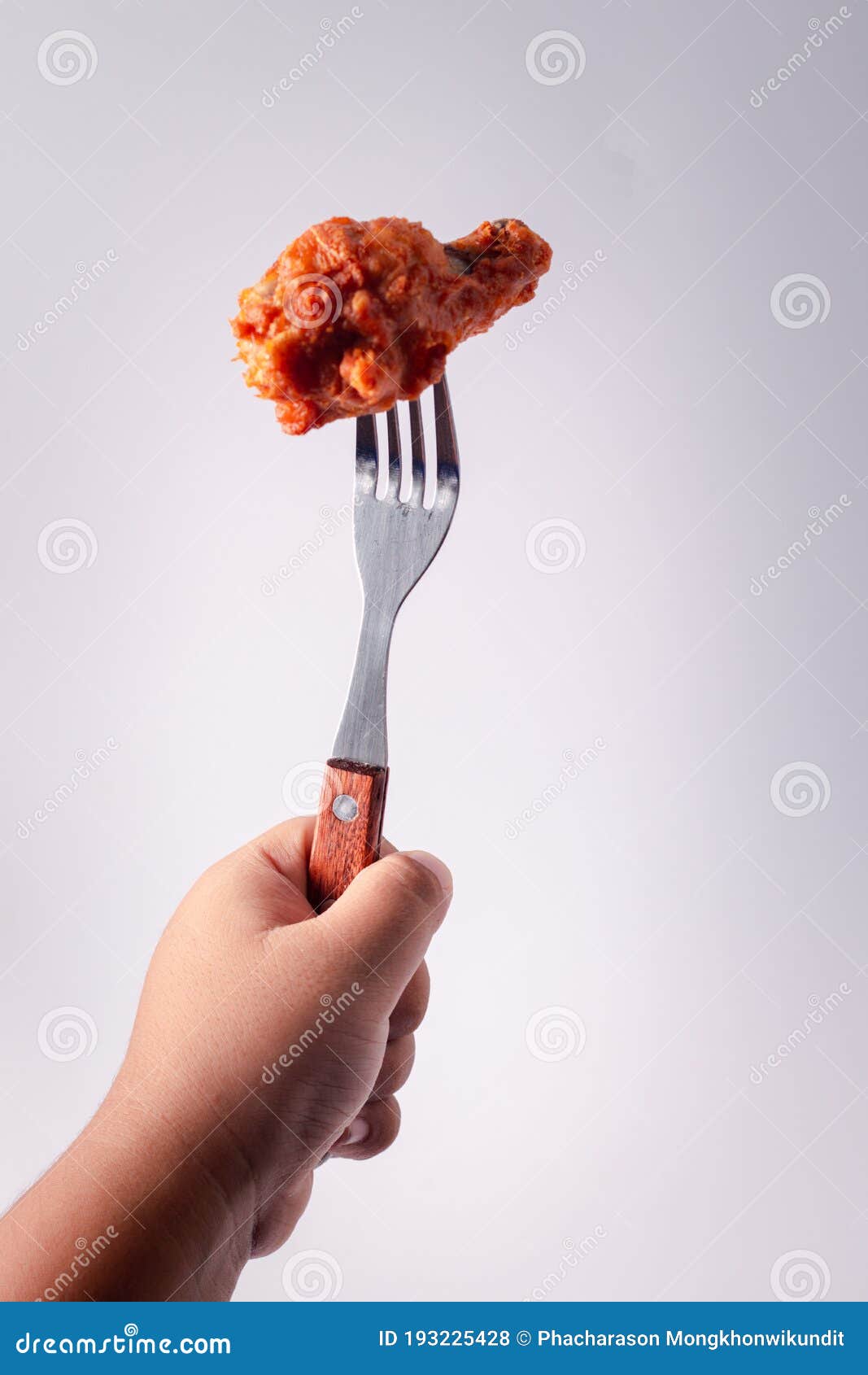 The Hand Was Holding Fork in a Fried Chicken Stock Photo - Image of ...
