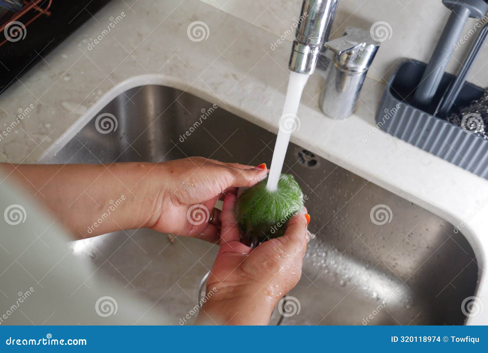 Hand Washing Avocado with Water Sprinkling Stock Photo - Image of green ...