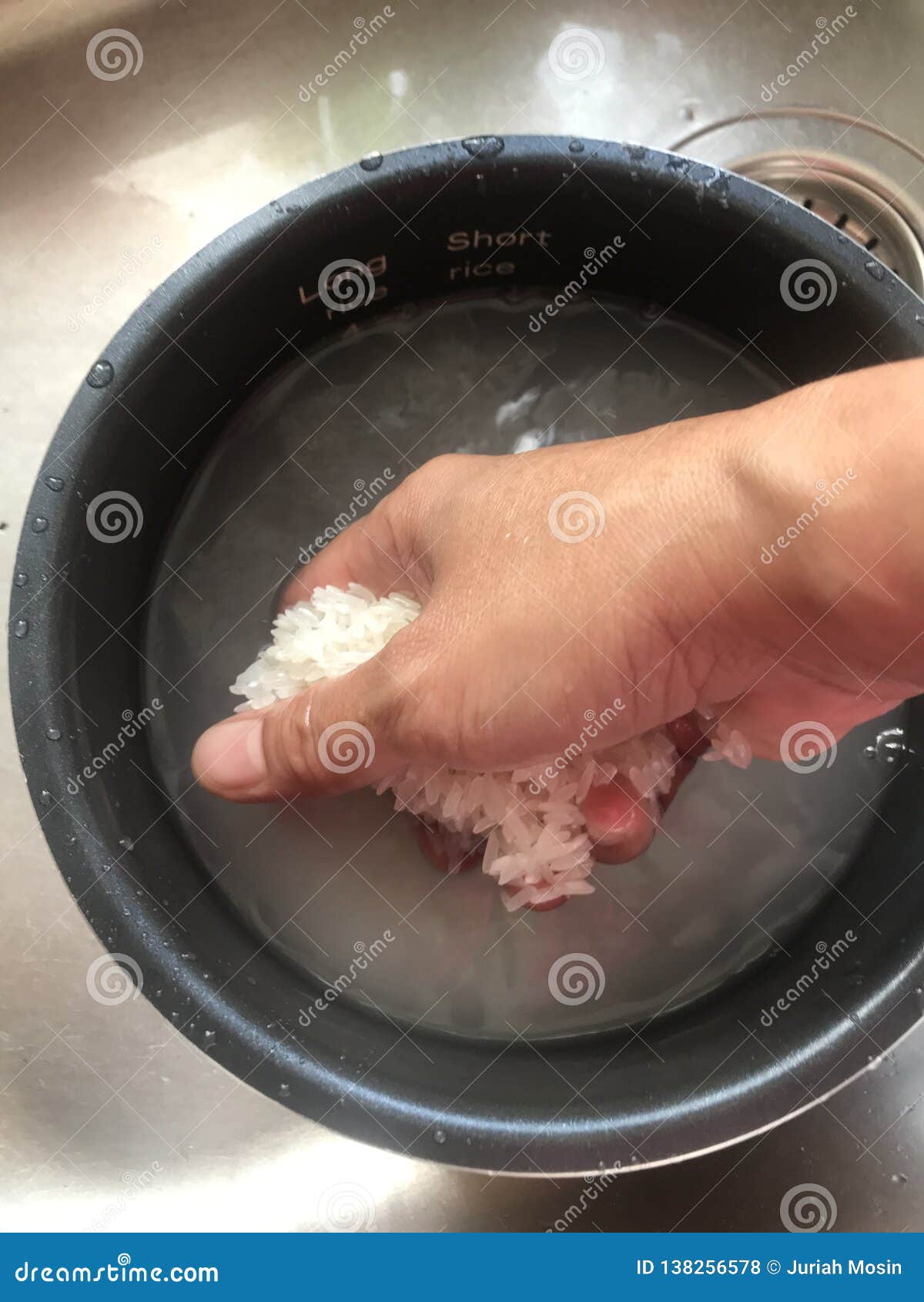 Hand washing rice stock photo. Image of grain, water - 138256578