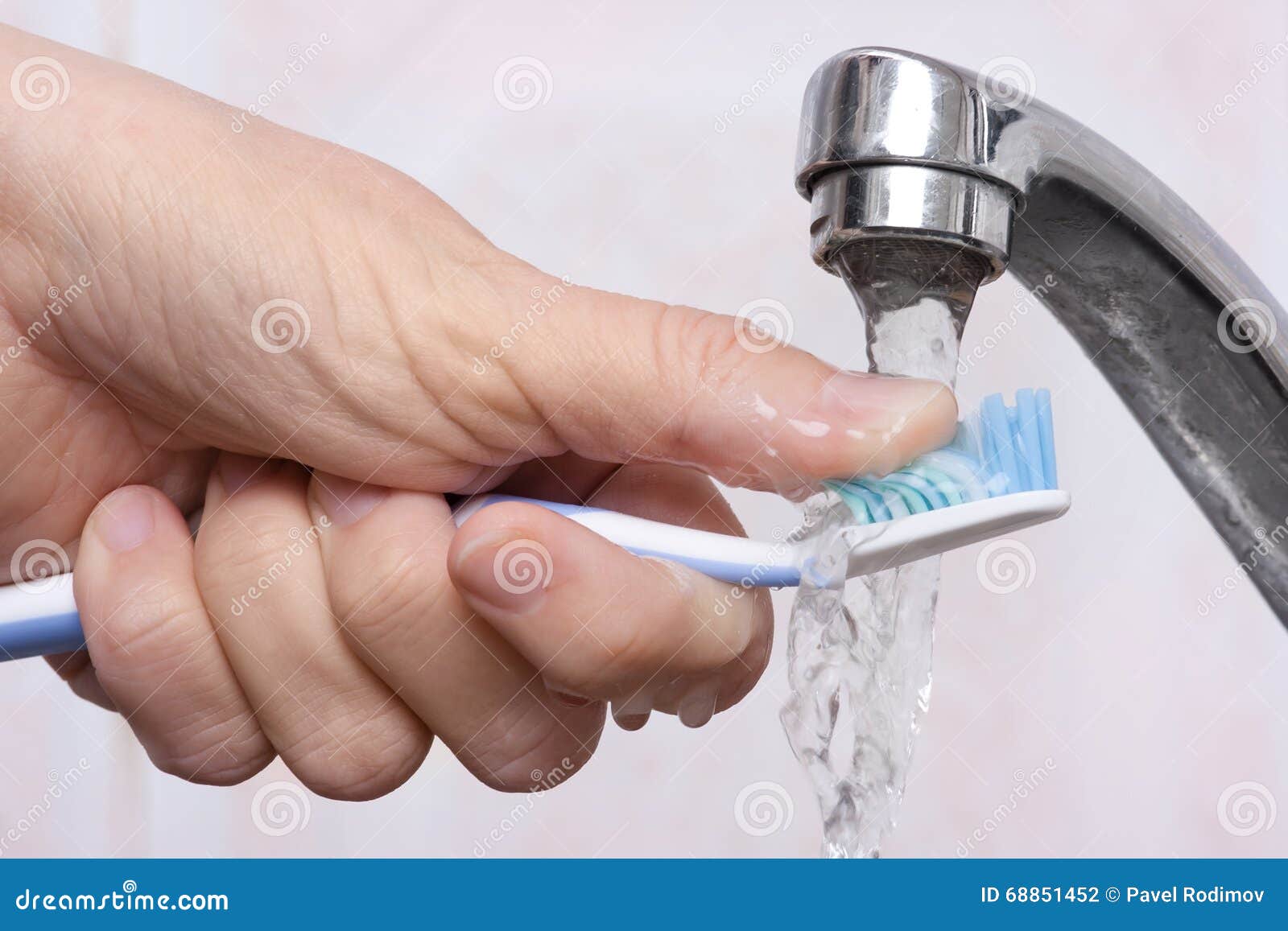 Hand washing toothbrush stock photo. Image of washroom - 68851452