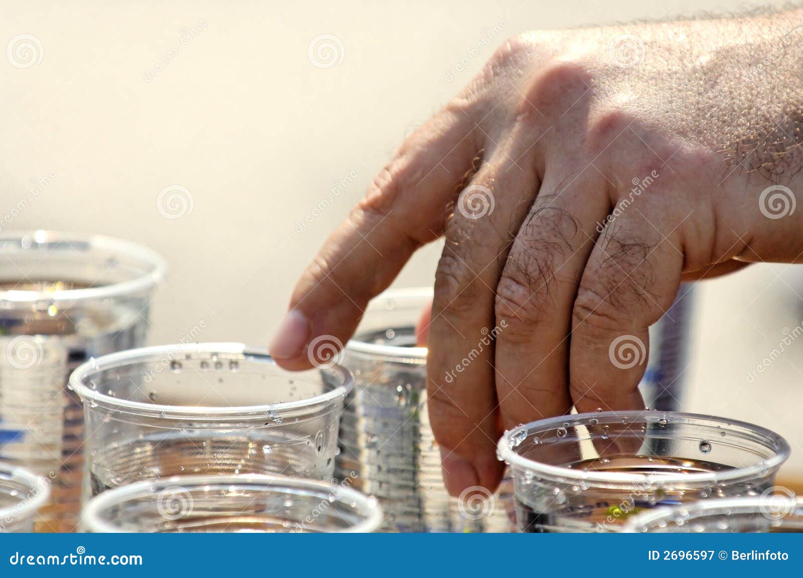 Hand on water cup stock image. Image of grasp, reaches - 2696597