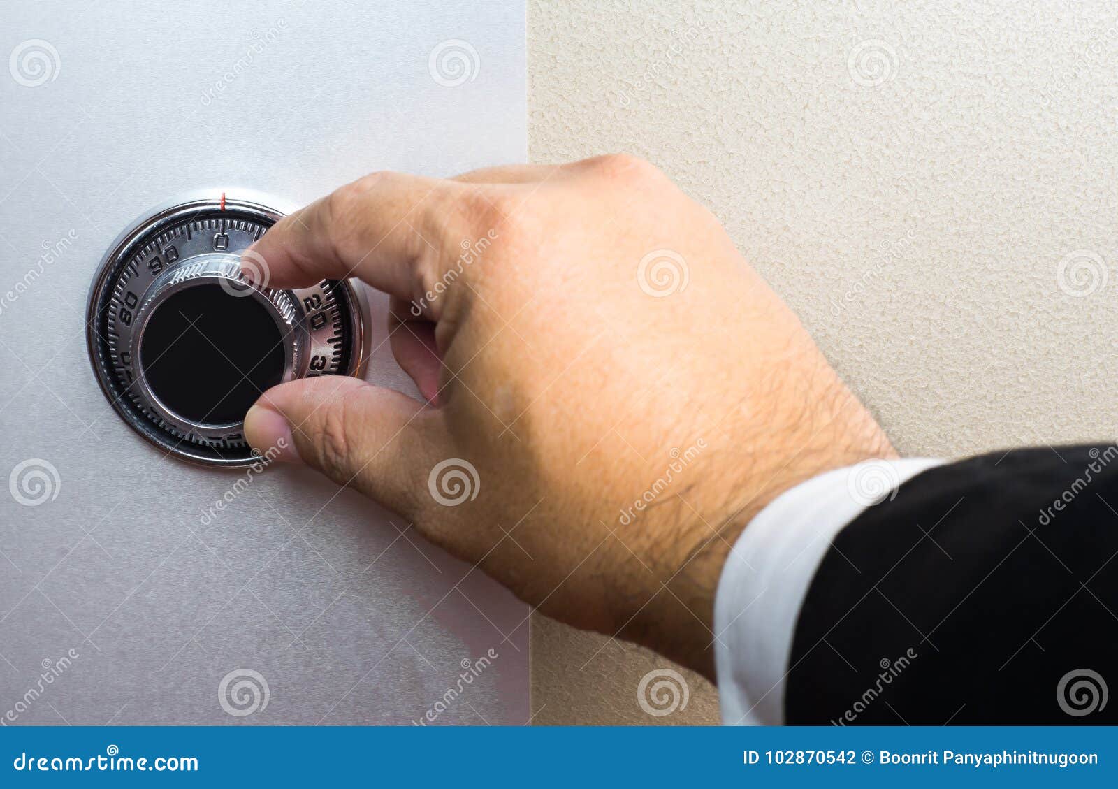 Hand Wearing Business Suit Turning Safe Dial Lock Stock Photo - Image ...