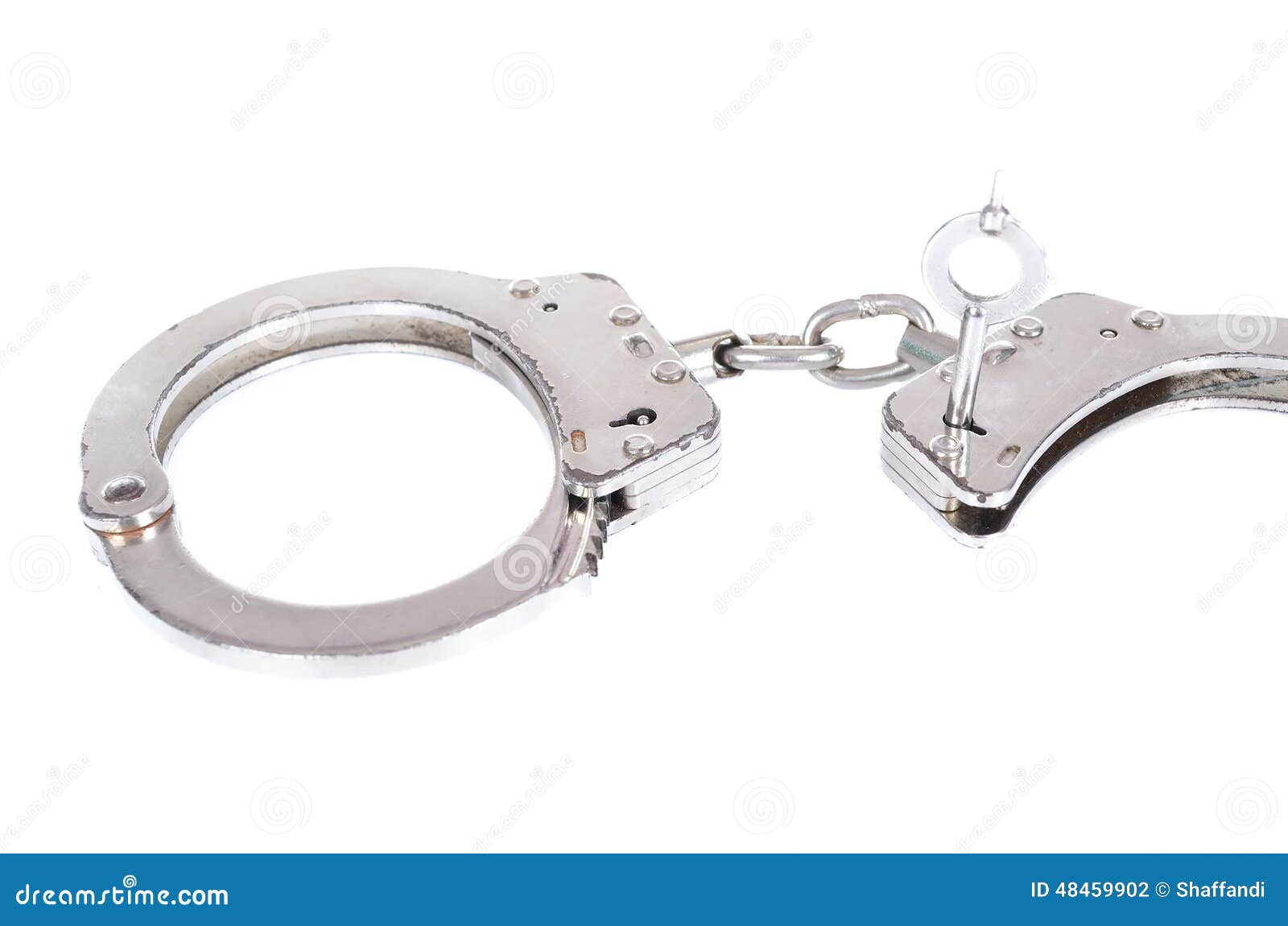 Hand wearing handcuffs stock photo. Image of background - 48459902