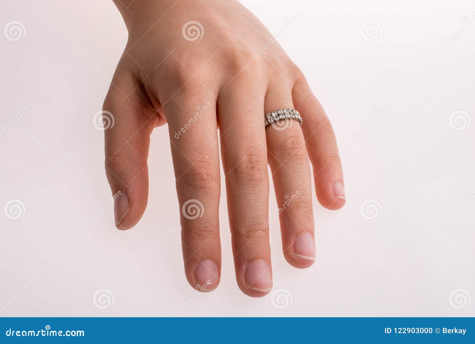 Hand wearing a ring stock photo. Image of love, holding - 122903000