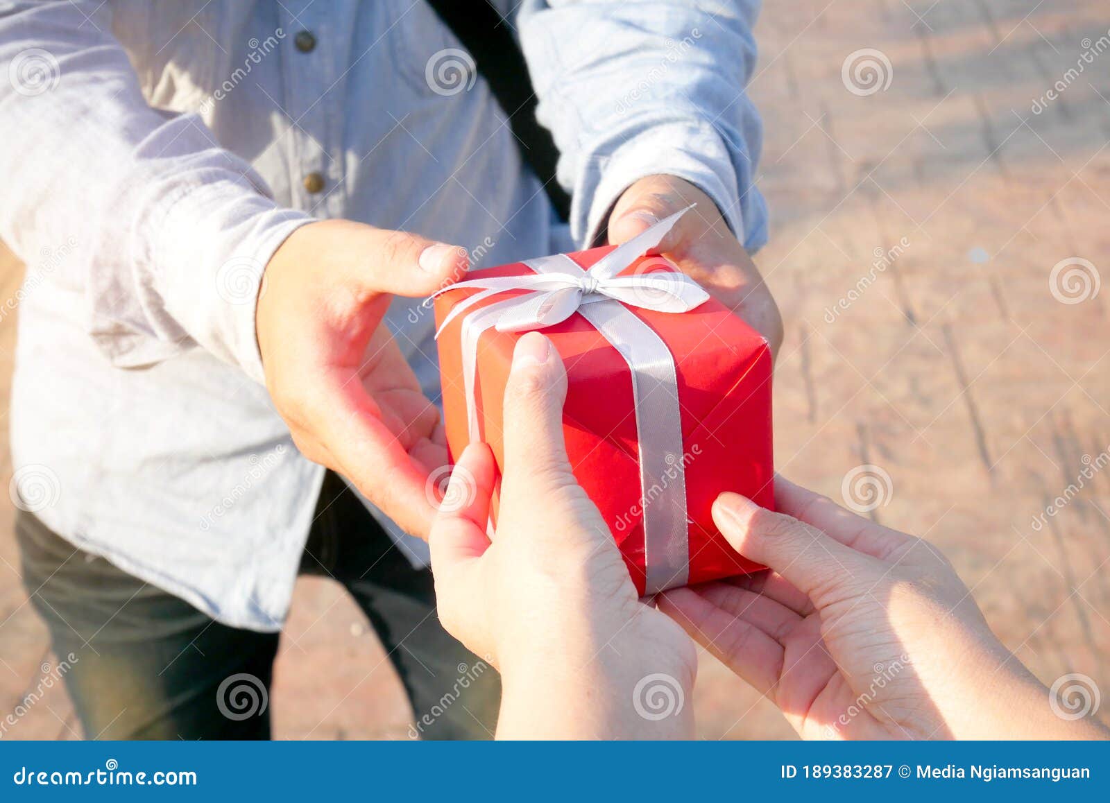 Hand of Woman Giving Gift Box Red in with Hands Stock Image - Image of ...