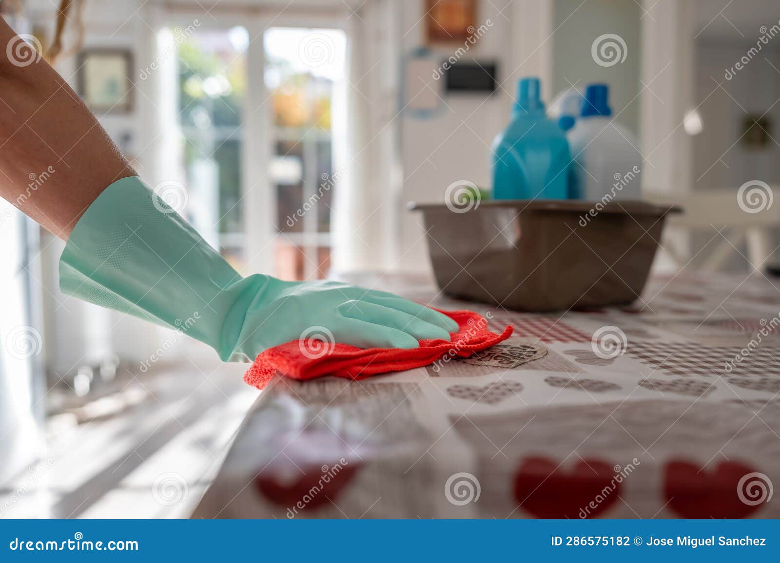 Hand of a Woman with Gloves Wiping the Surface of a Table with a Rag ...