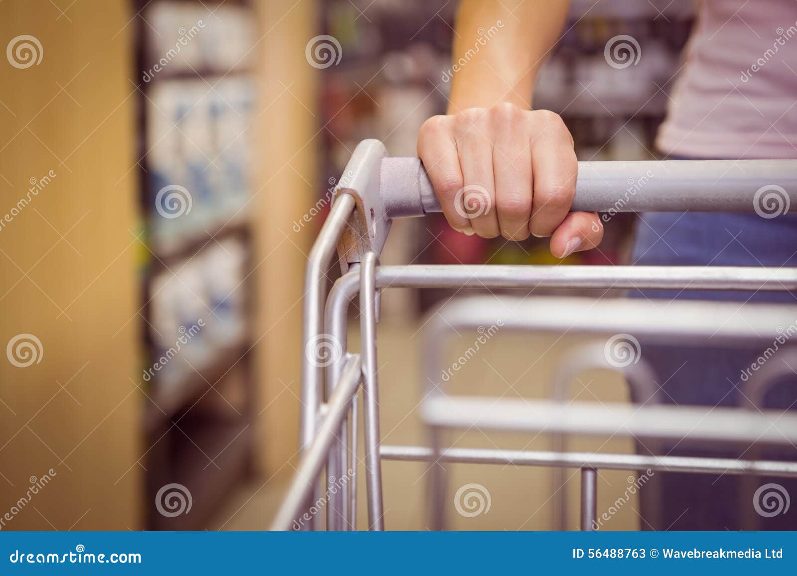 Hand of Woman Putting on Trolley Stock Image - Image of hand ...
