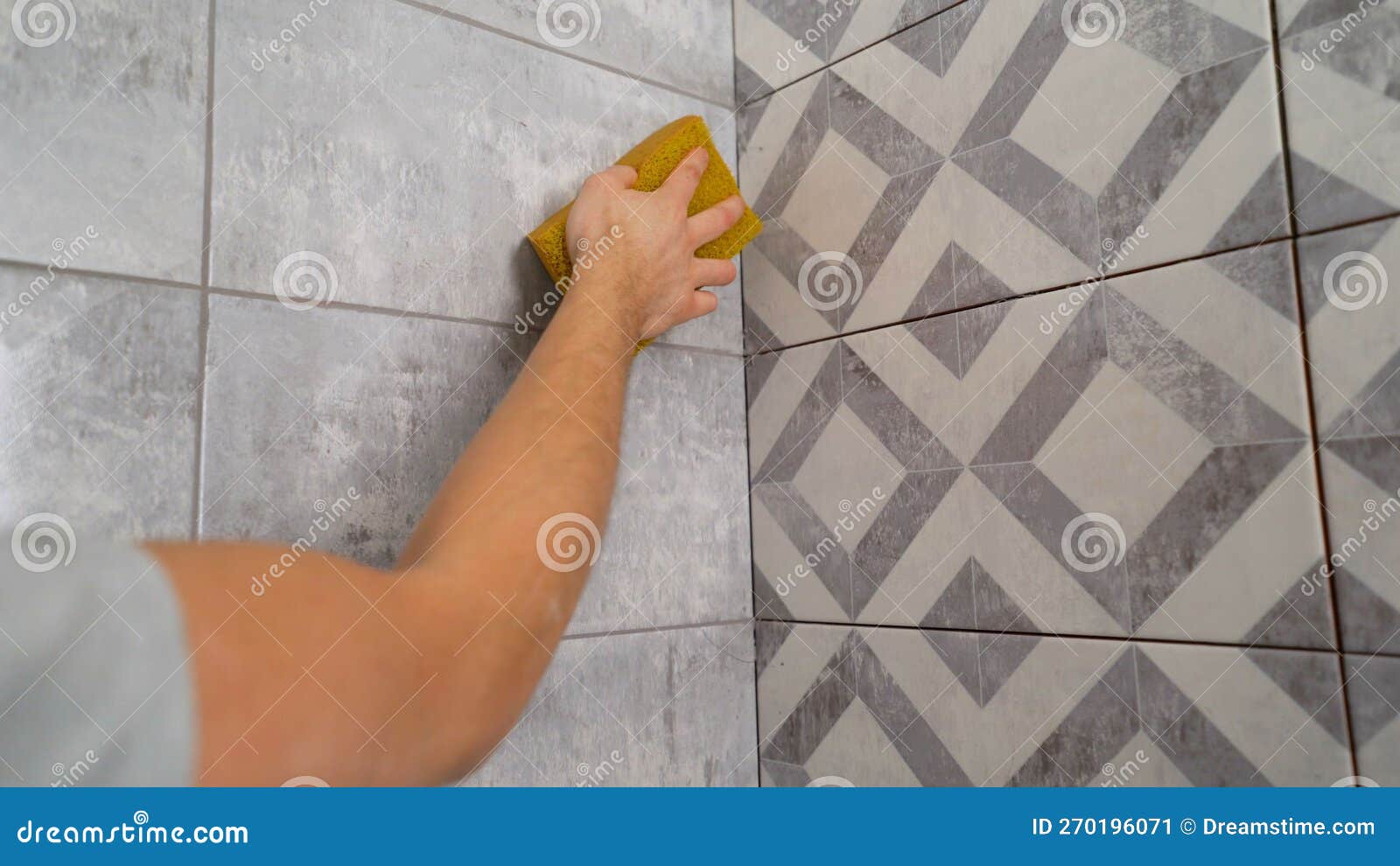 The Hand of a Worker Cleaning Ceramic Tiles. Close-up of Hands Cleaning ...
