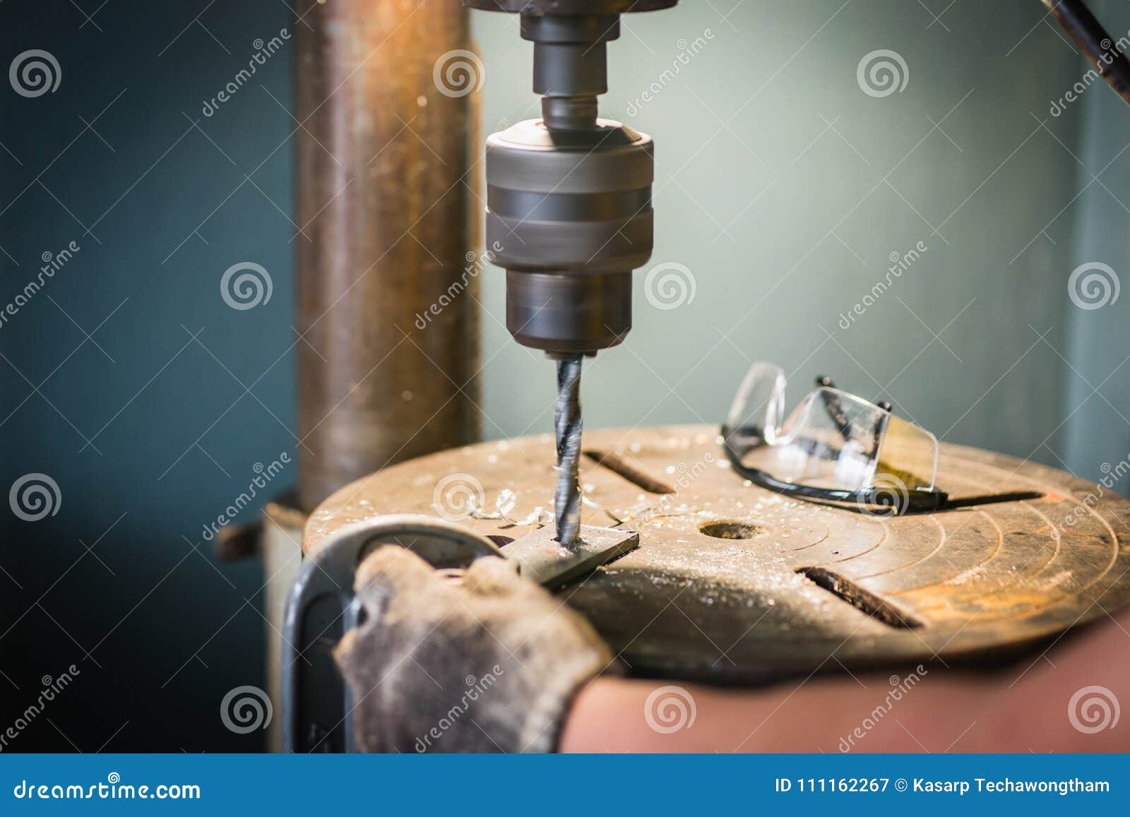 Hand of Worker Man Drills a Hole in Iron Bracket with Pillar Drilling ...