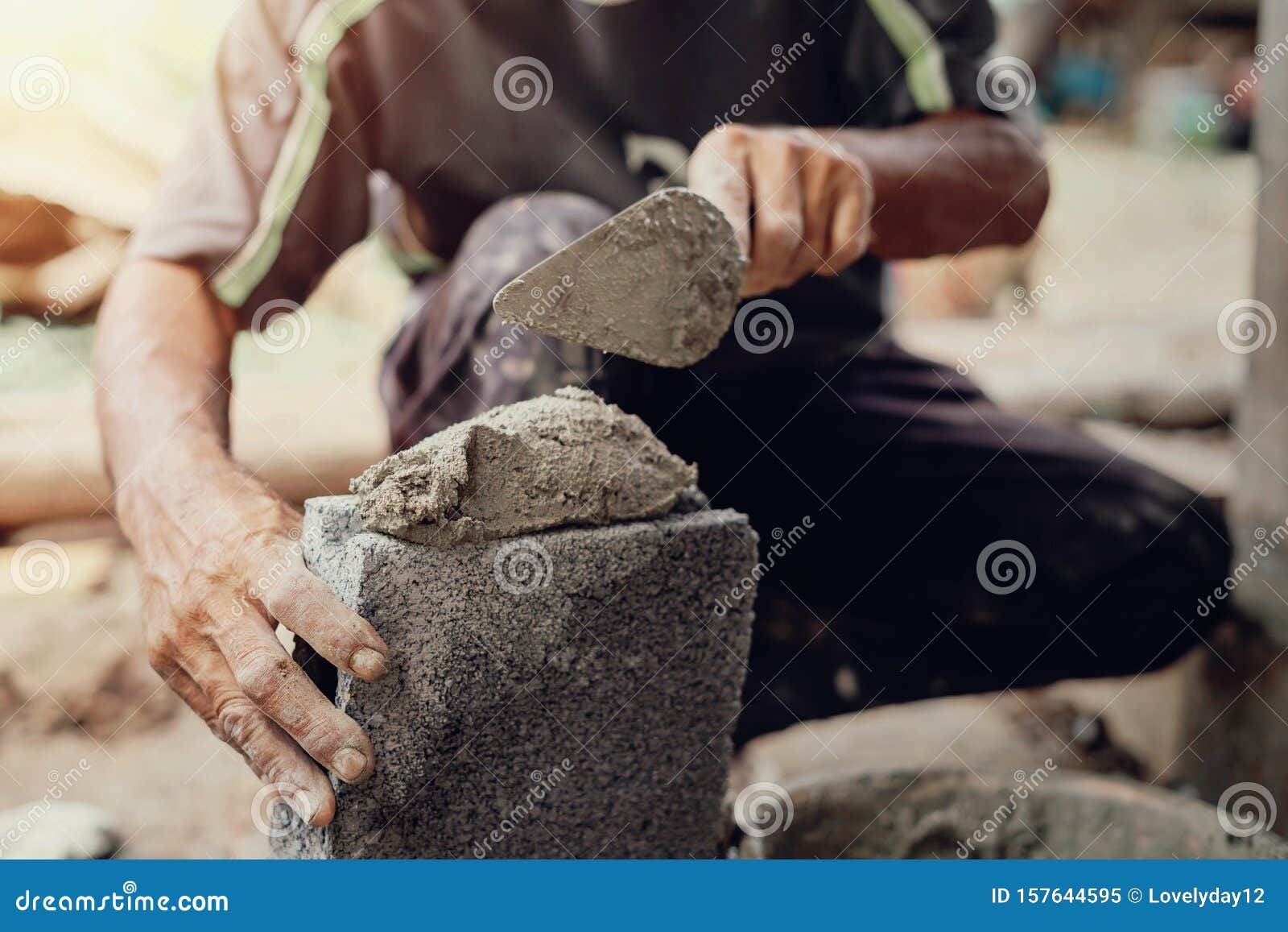 Hand of Worker Plastering Cement on Brick Wall at Construction Site ...