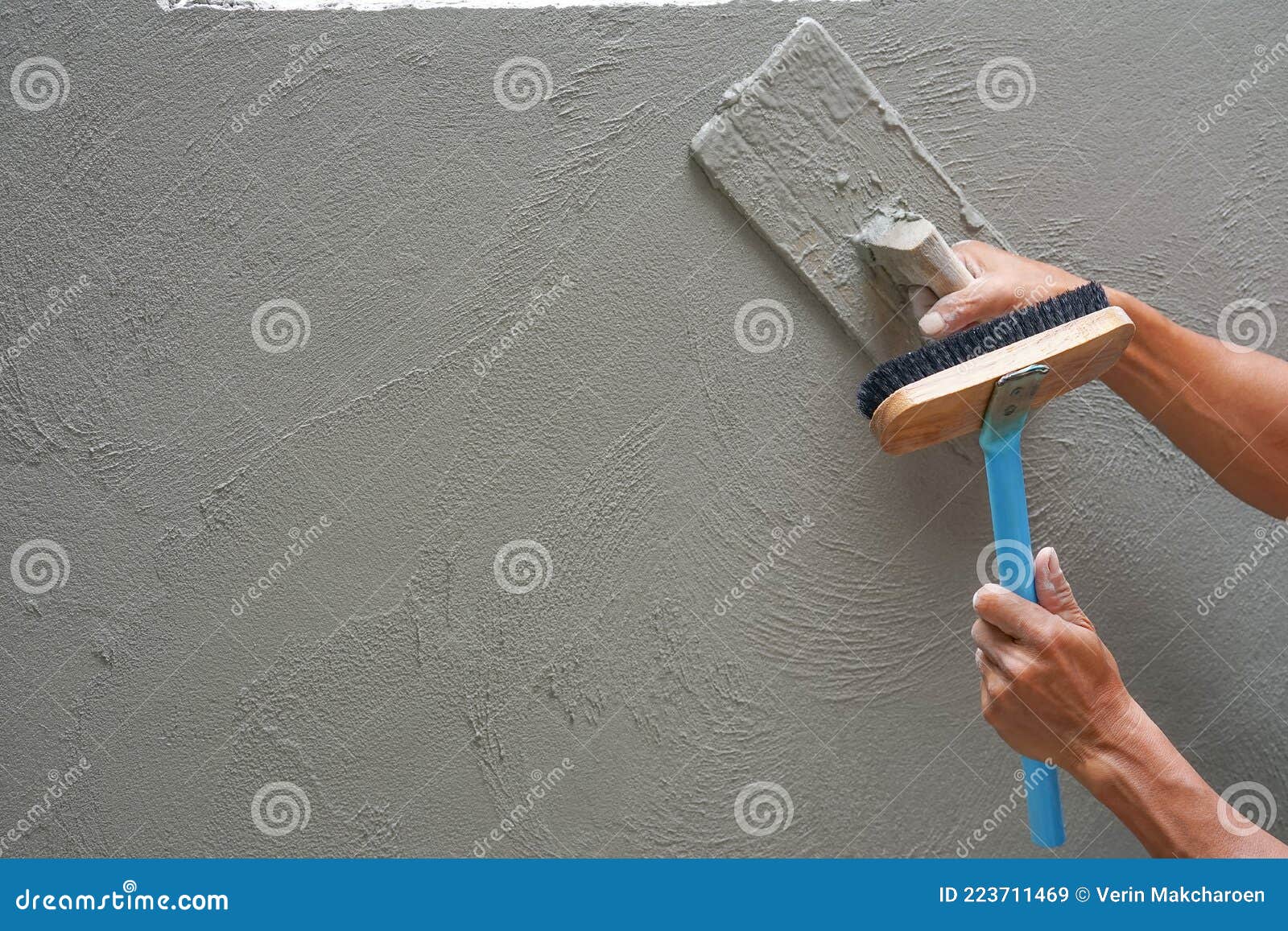 Hand of Worker Plastering Cement Wall at Construction Site with Copy ...