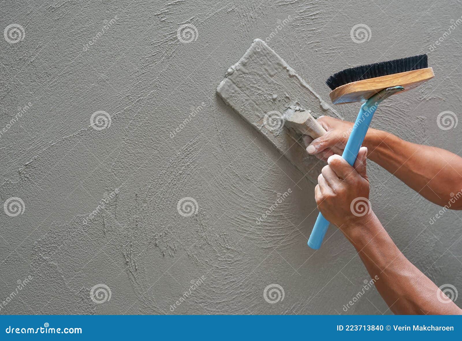 Hand of Worker Plastering Cement Wall at Construction Site with Copy ...