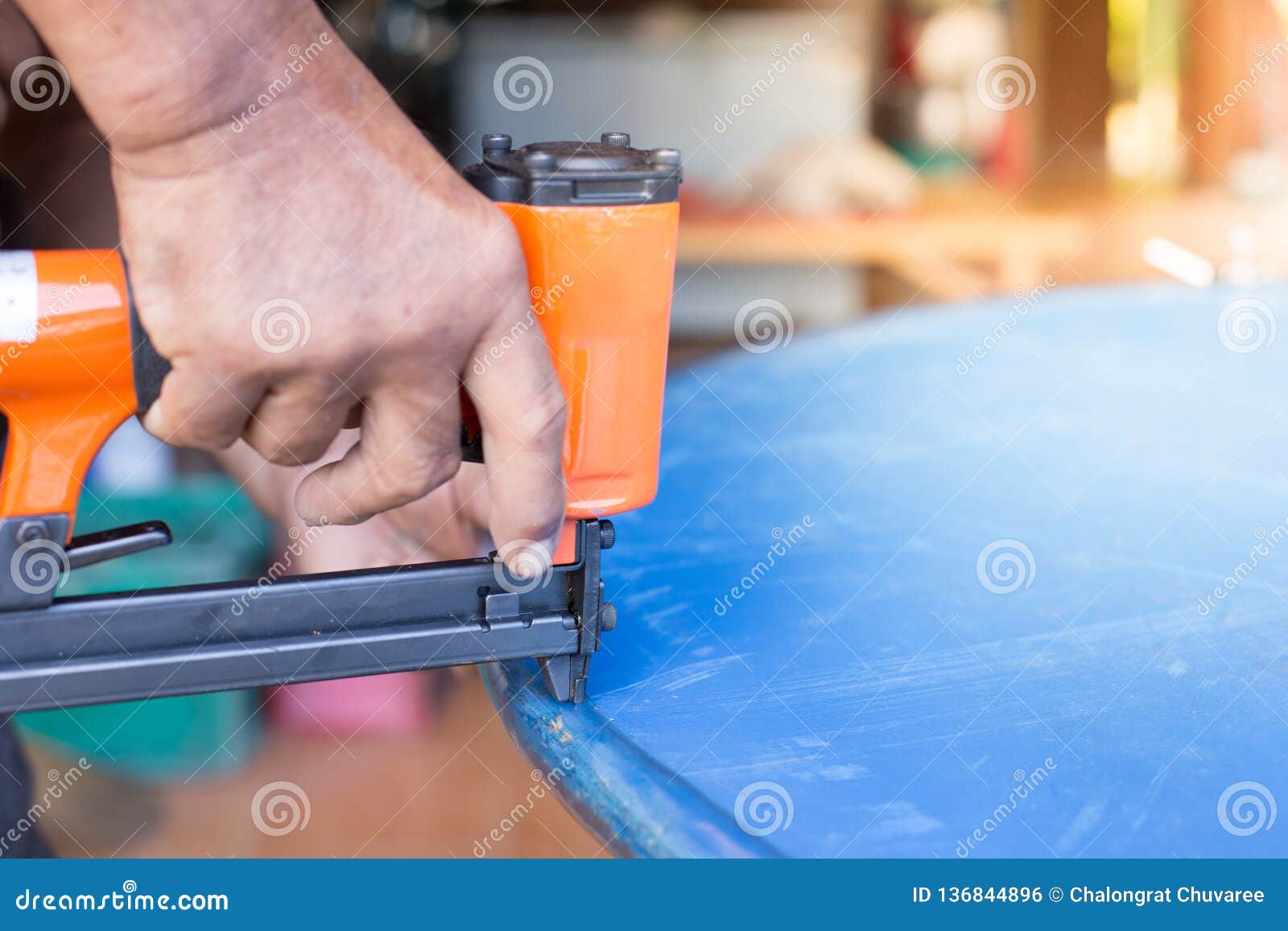 Hand of a Worker is Using a Nail Gun Stock Photo - Image of molding ...