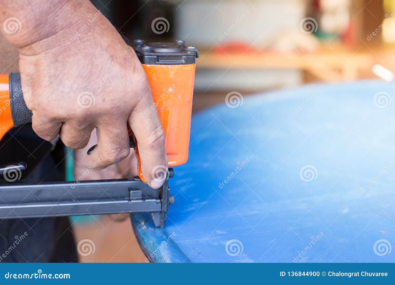 Hand of a Worker is Using a Nail Gun Stock Photo - Image of nail ...
