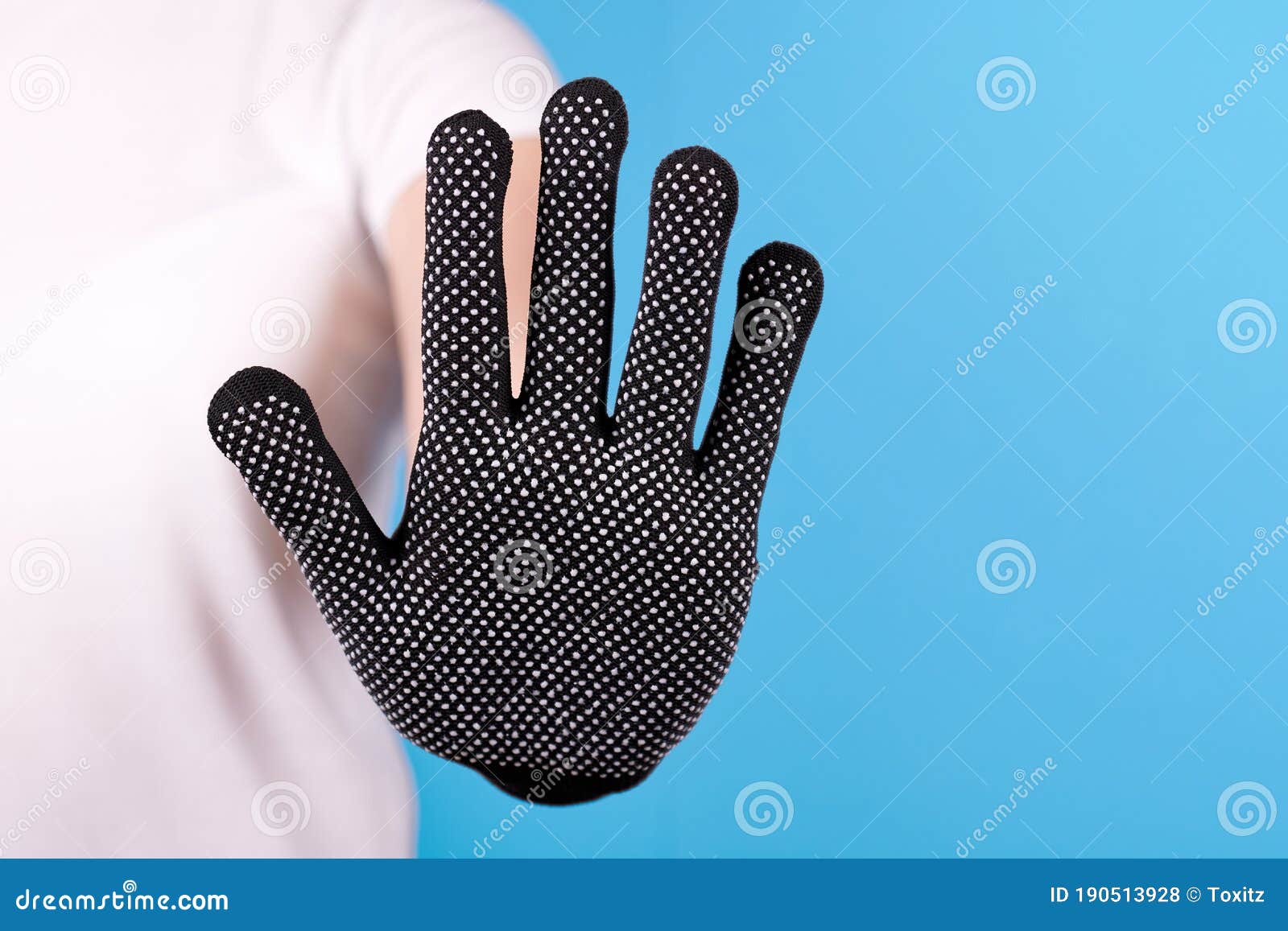 Hand in Working Glove, Stop Sign Gesture. Isolated on Blue Background ...