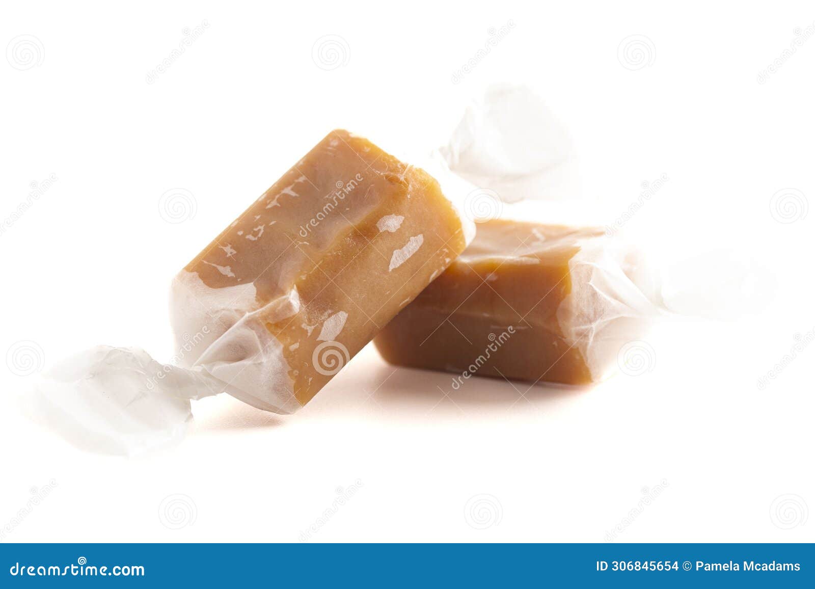 Two Hand Wrapped Soft Caramel Candies Isolated on a White Background ...