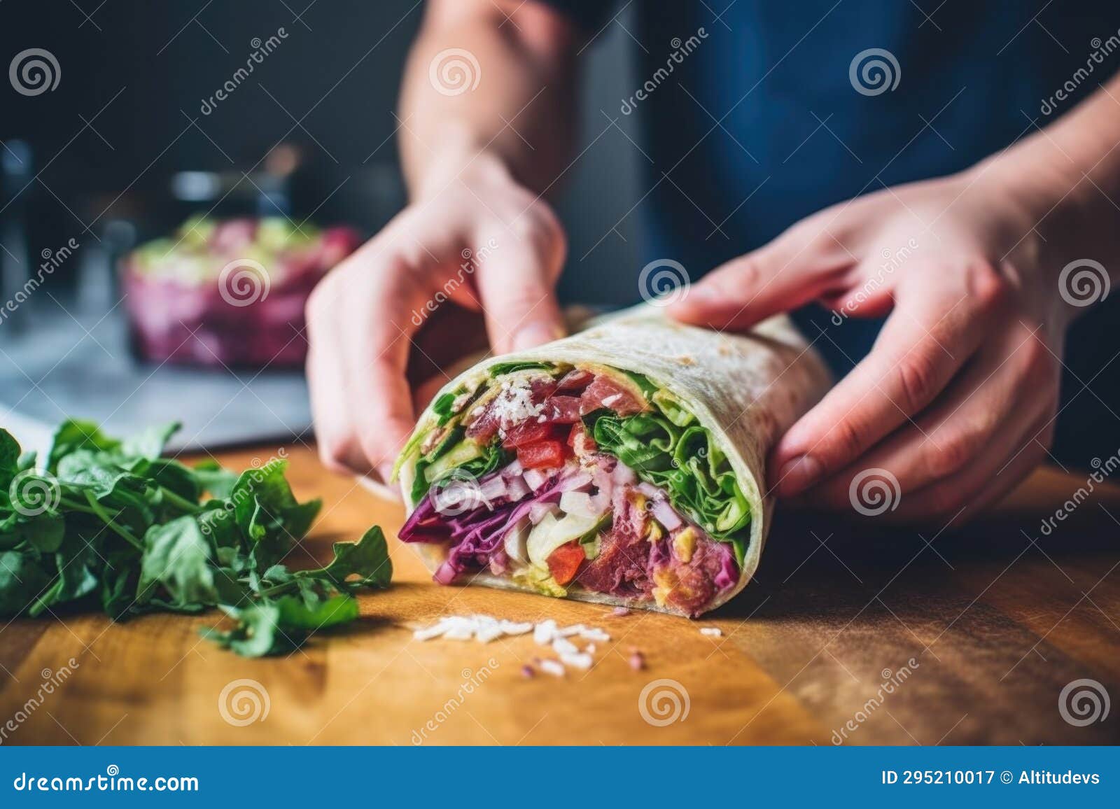 Hand Wrapping a Fresh Burrito with Mediterranean Fillings Stock Image ...