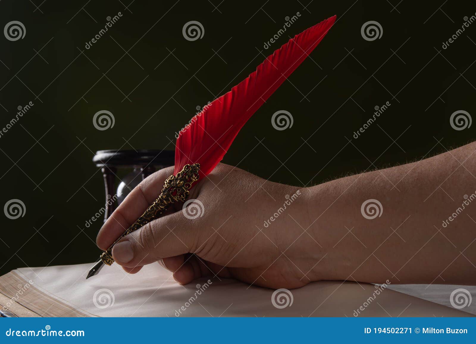 Hand Writing with Fountain Pen with Red Feather in a Notebook ...