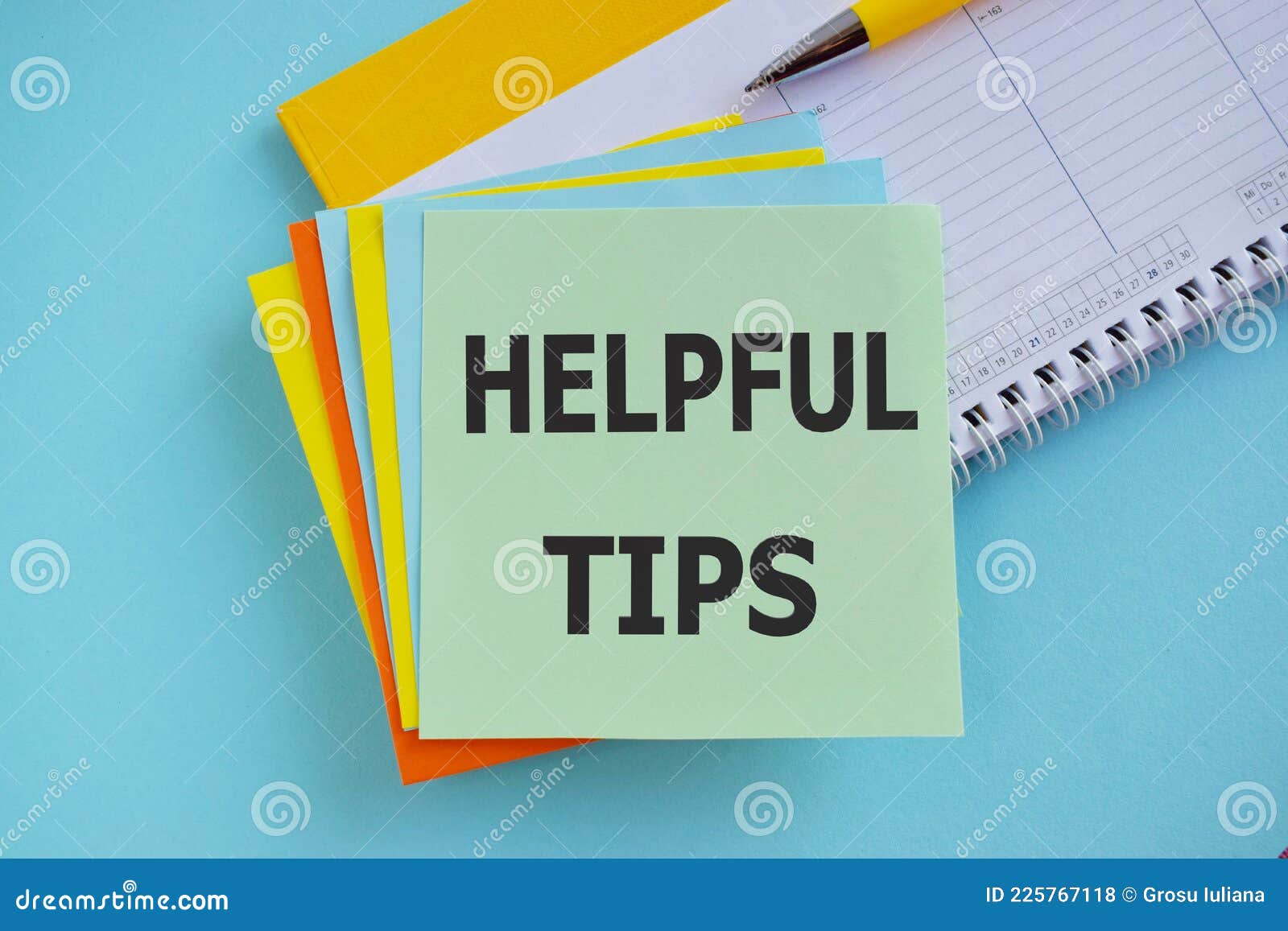 Hand Writing Helpful Tips with Black Marker on Colorful Sticker Note ...
