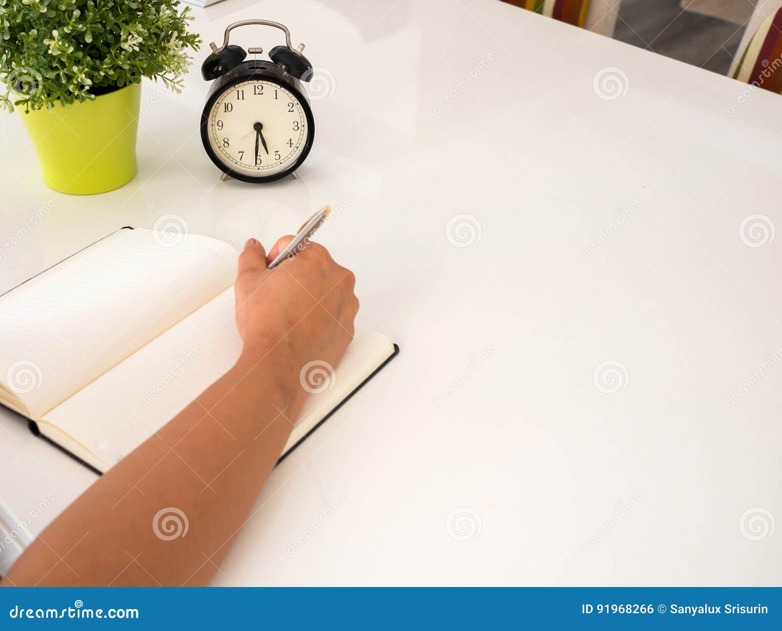 Hand Writing on a Notebook on a Table Stock Photo - Image of dateline ...