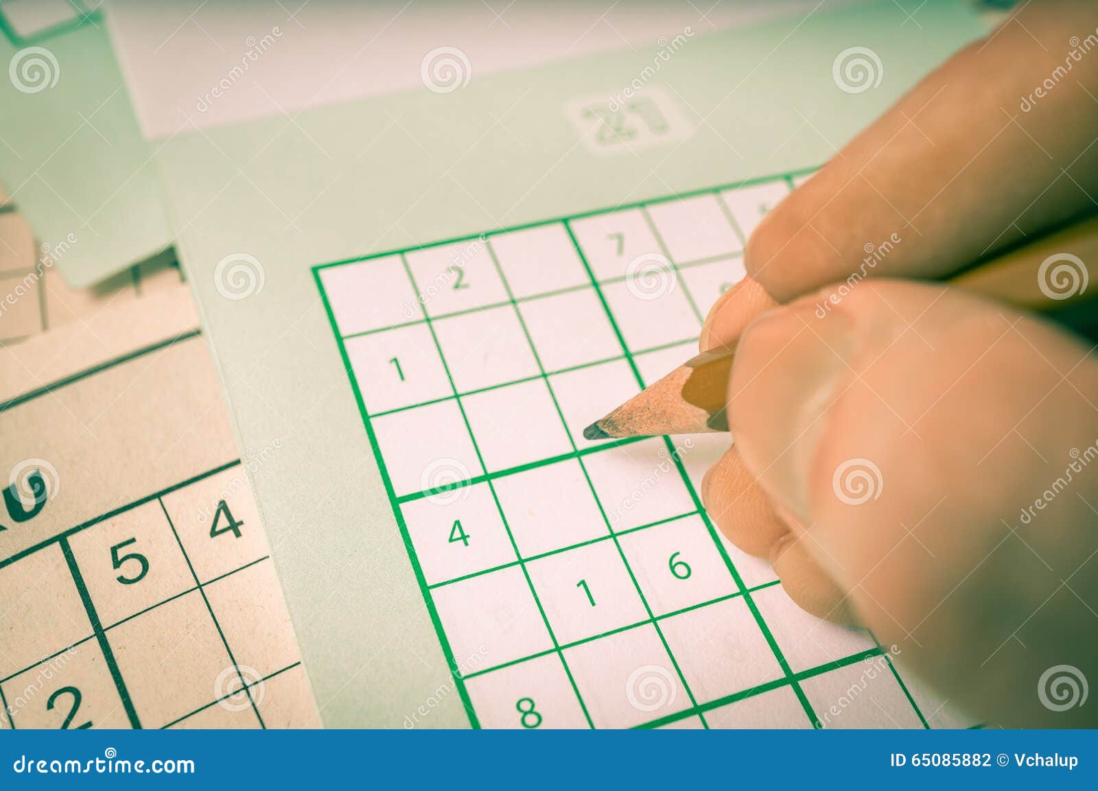 Hand is Writing Numbers in Grid of Popular Logic Game Sudoku Stock ...
