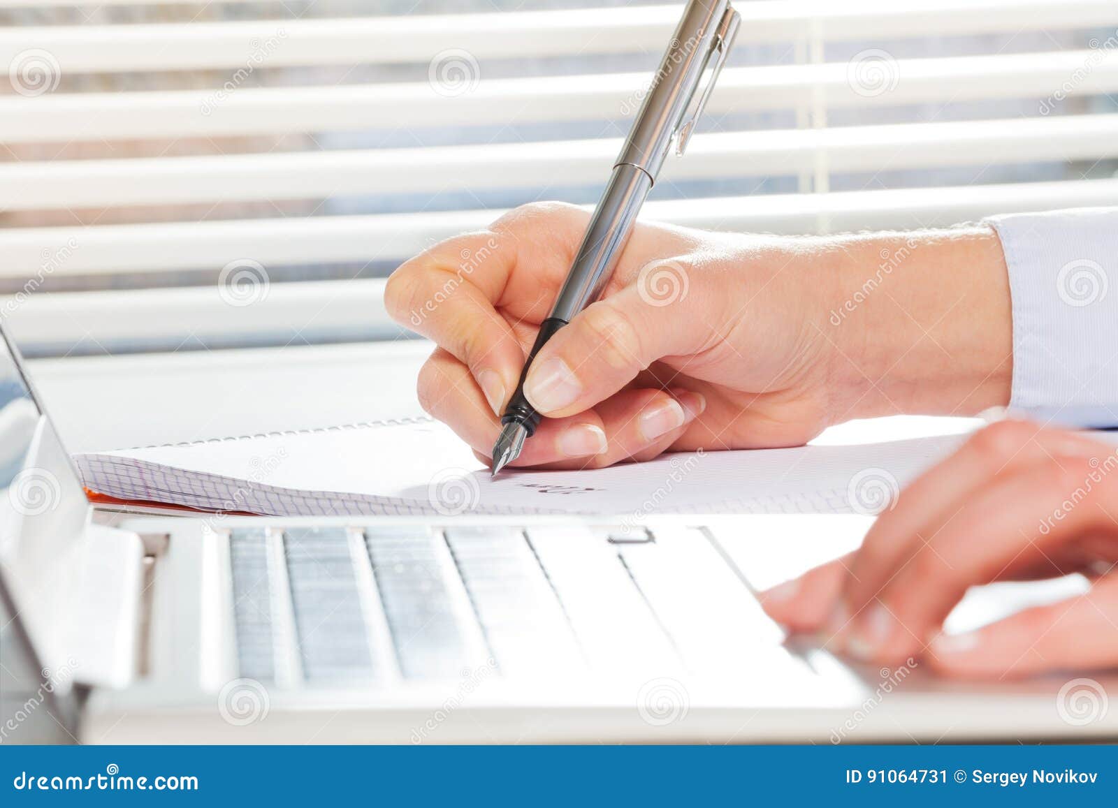 Hand Writing with a Pen while Working on Computer Stock Image - Image ...