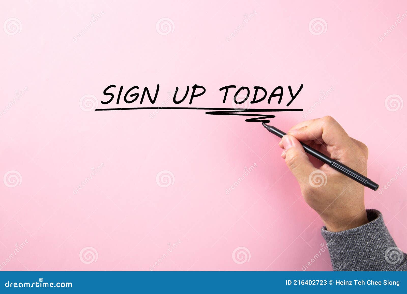 A Hand Writing a Word SIGN UP TODAY on Pink Background Stock Image ...