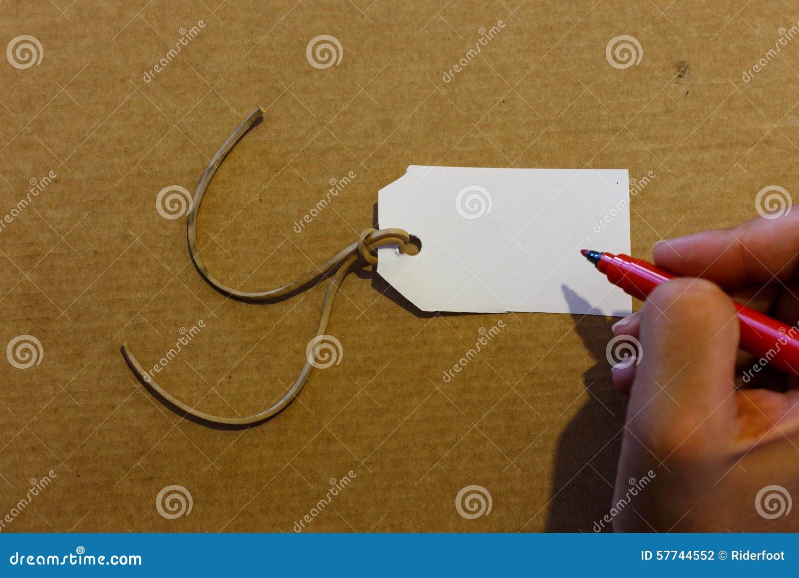 Hand writting in a tag stock photo. Image of blank, attach - 57744552