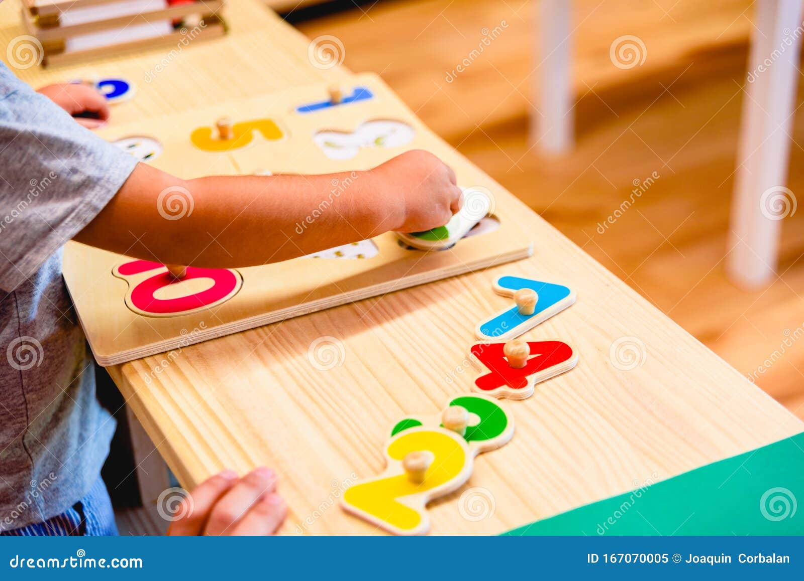 Hand of 2 Year Old Boy in Elementary Class Using a Toy To Develop Motor ...