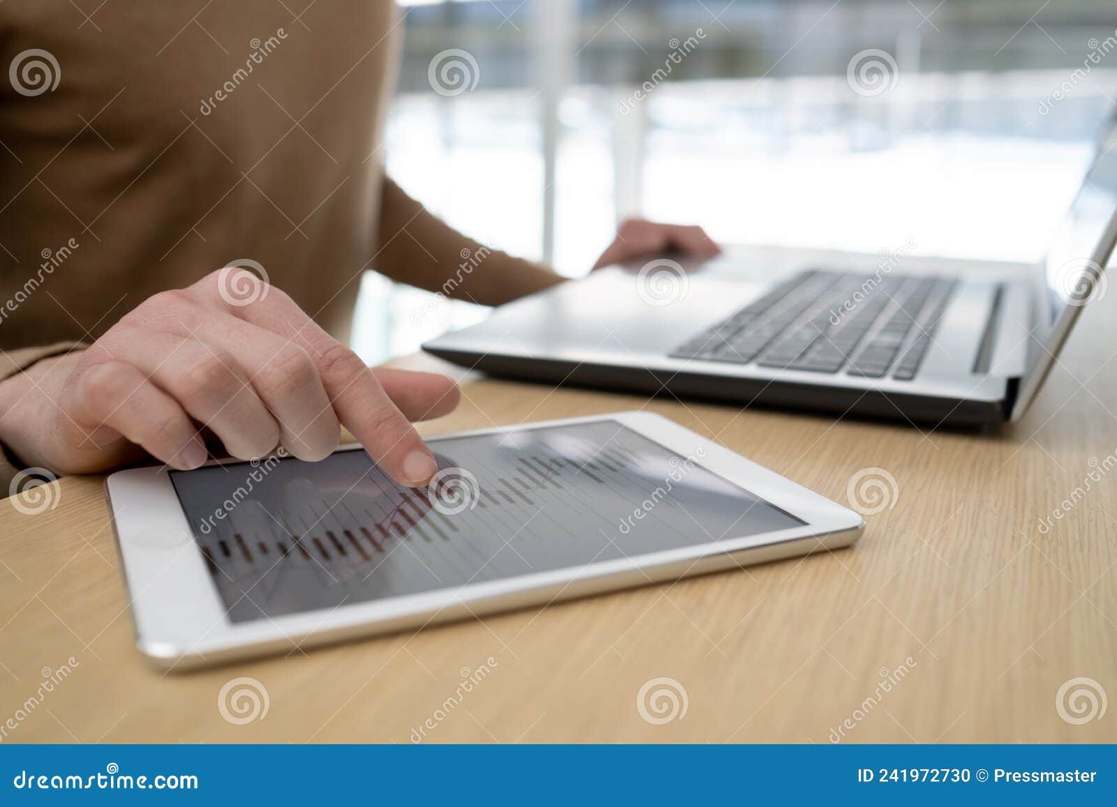Hand of Young Businessman Pointing at Data on Tablet Screen Stock Photo ...