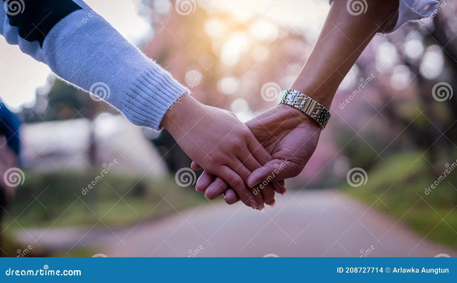 The Hand of the Young Couple Holding Hands Walking Forward on the Day ...