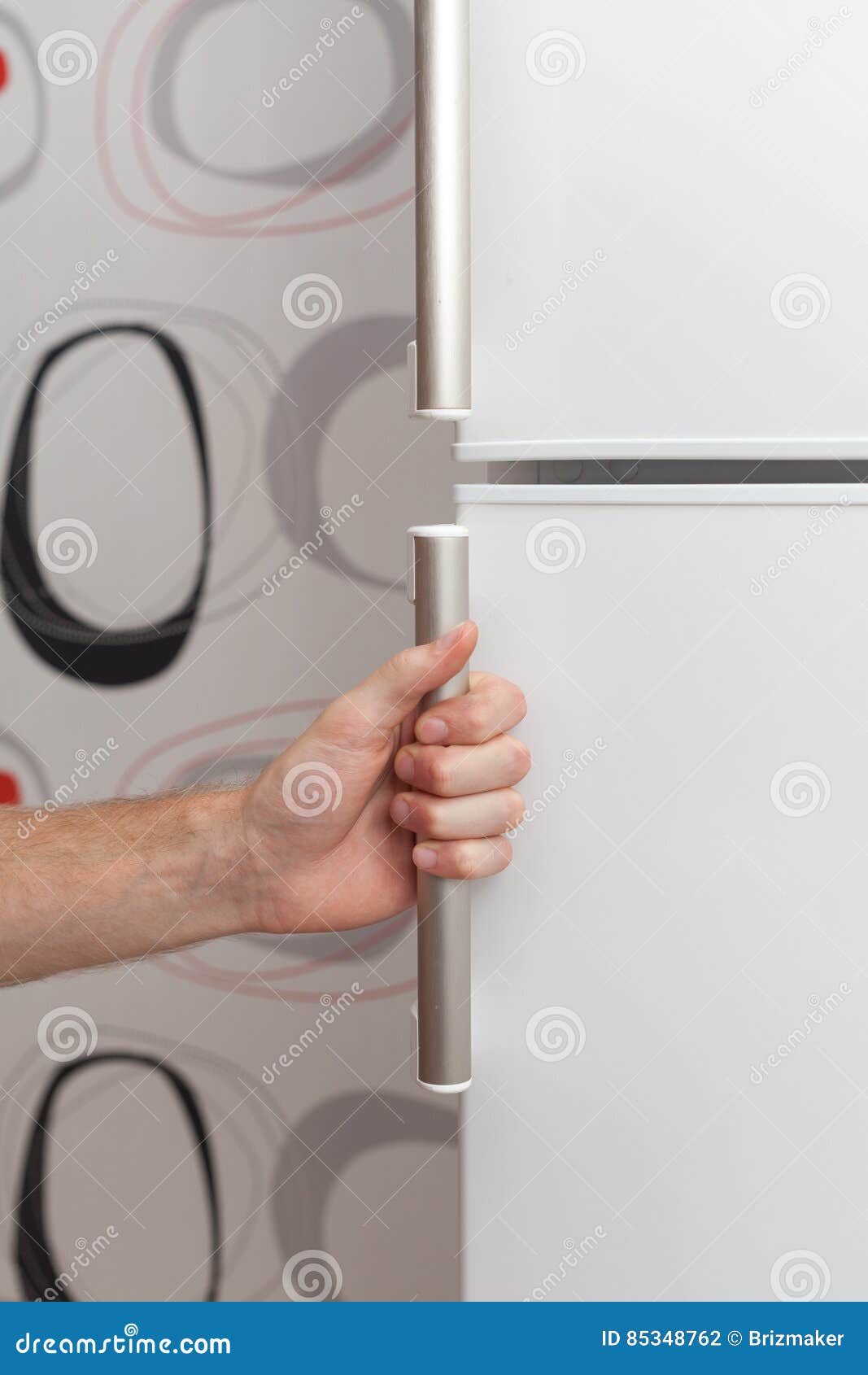 The Hand of a Young Man is Opening a Freezer Door. Stock Photo - Image ...