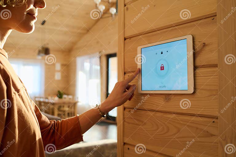 Hand of Young Woman on Panel of Alarm System with Lock Sign on Screen ...