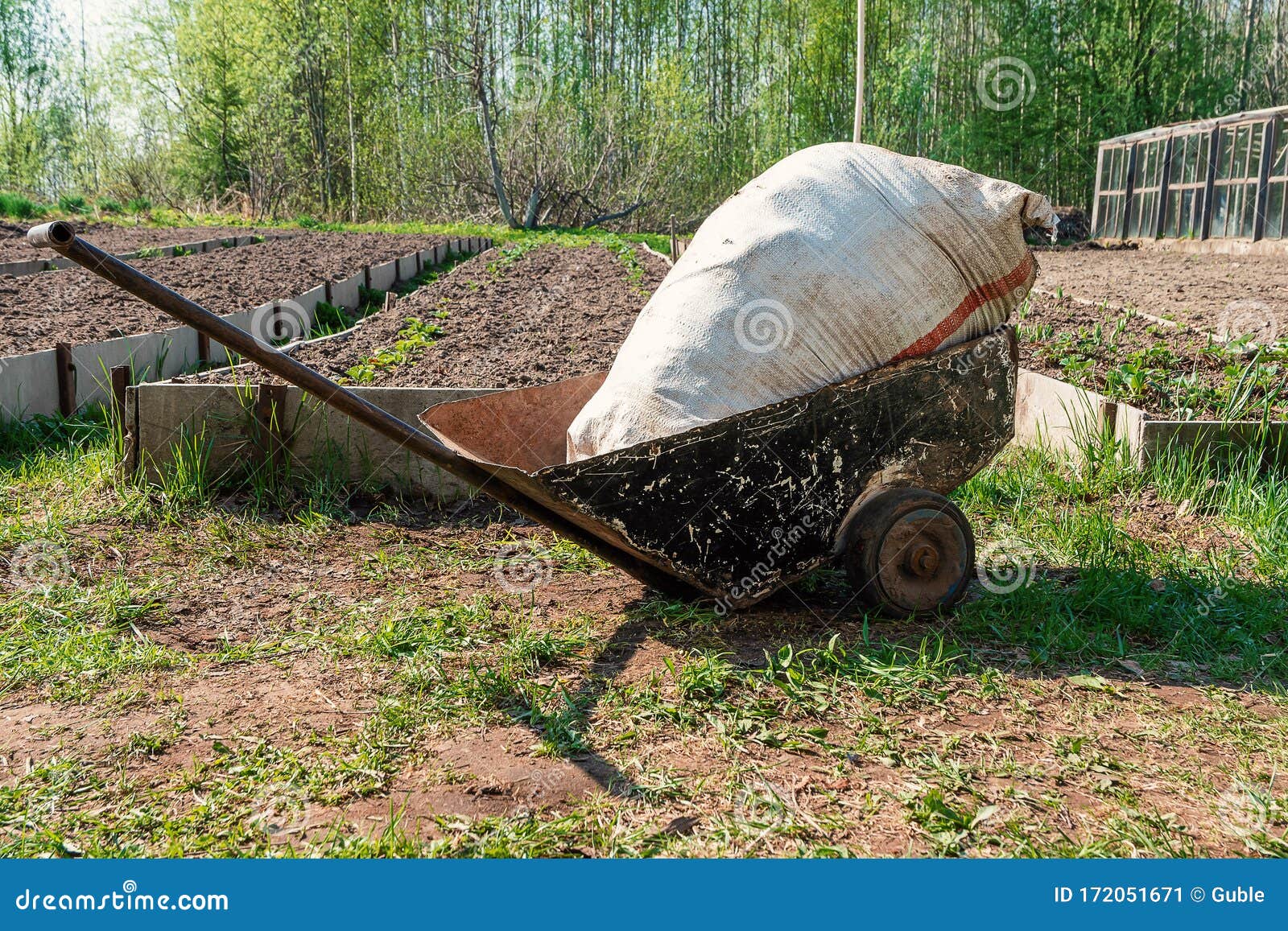 Handcart with a Bag of Fertilizers on the Farm. Beginning of Spring ...