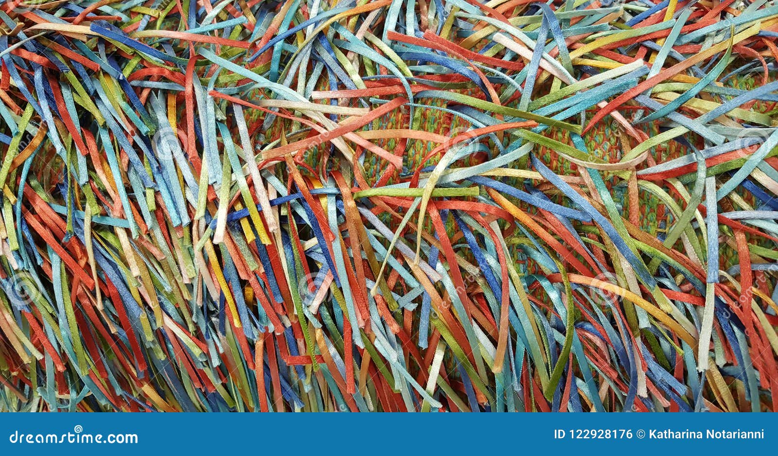 A Rainbow of Colorful Strands of Ribbons and Threads Stock Photo ...