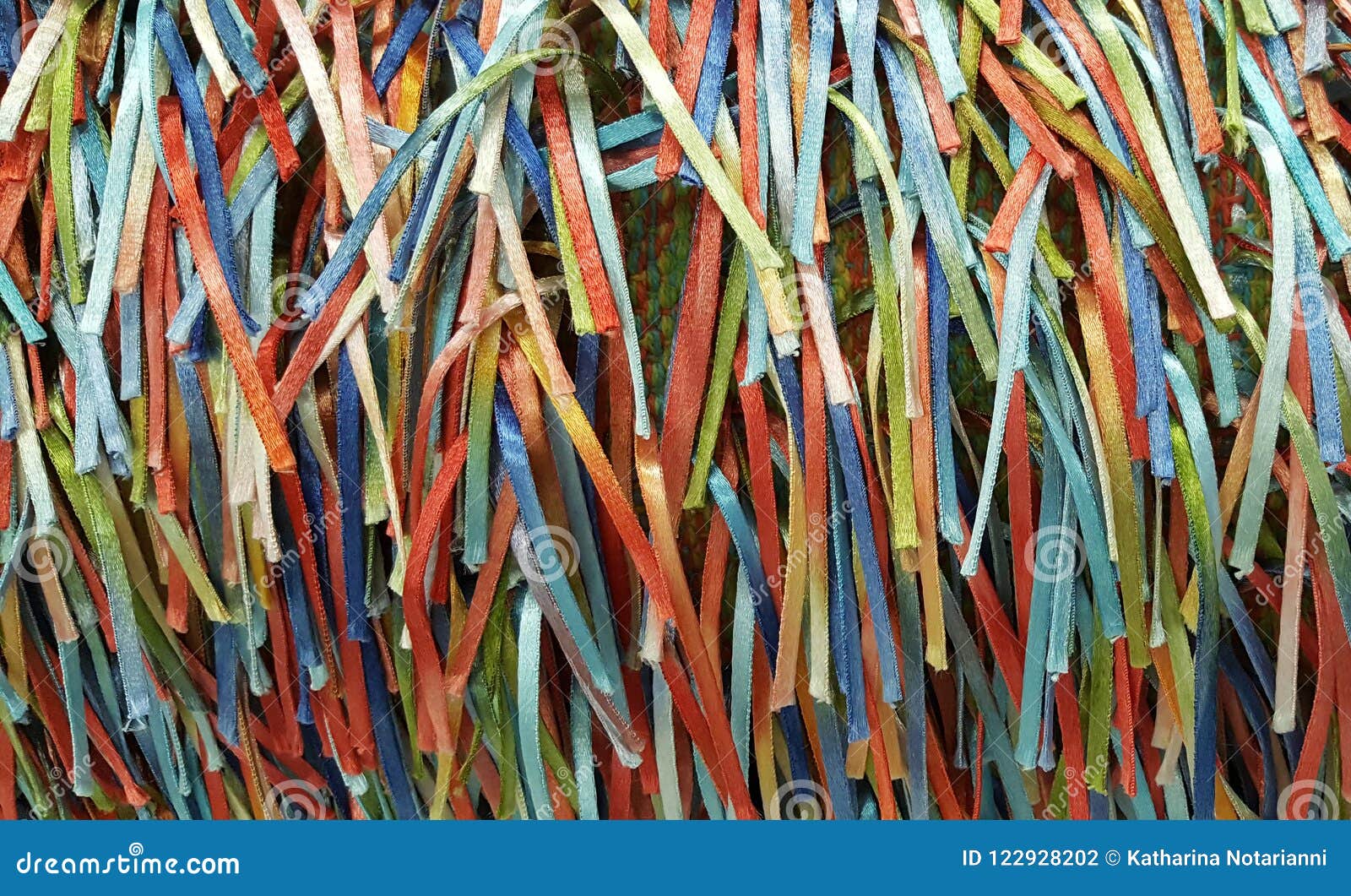 A Rainbow of Colorful Strands of Ribbons and Threads Stock Photo ...