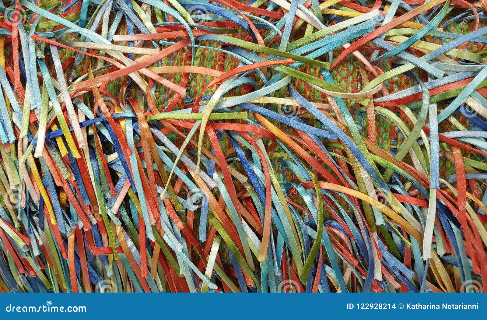 A Rainbow of Colorful Strands of Ribbons and Threads Stock Photo ...