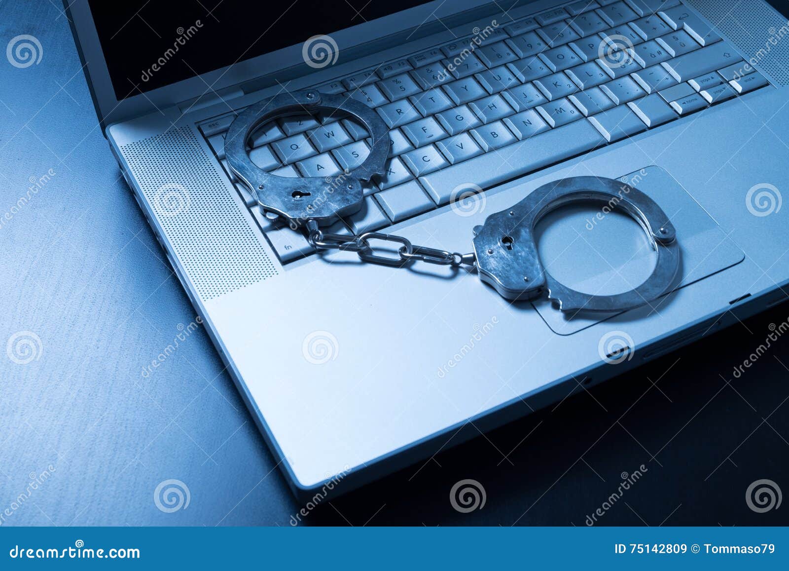 Handcuff on laptop stock image. Image of internet, metal - 75142809