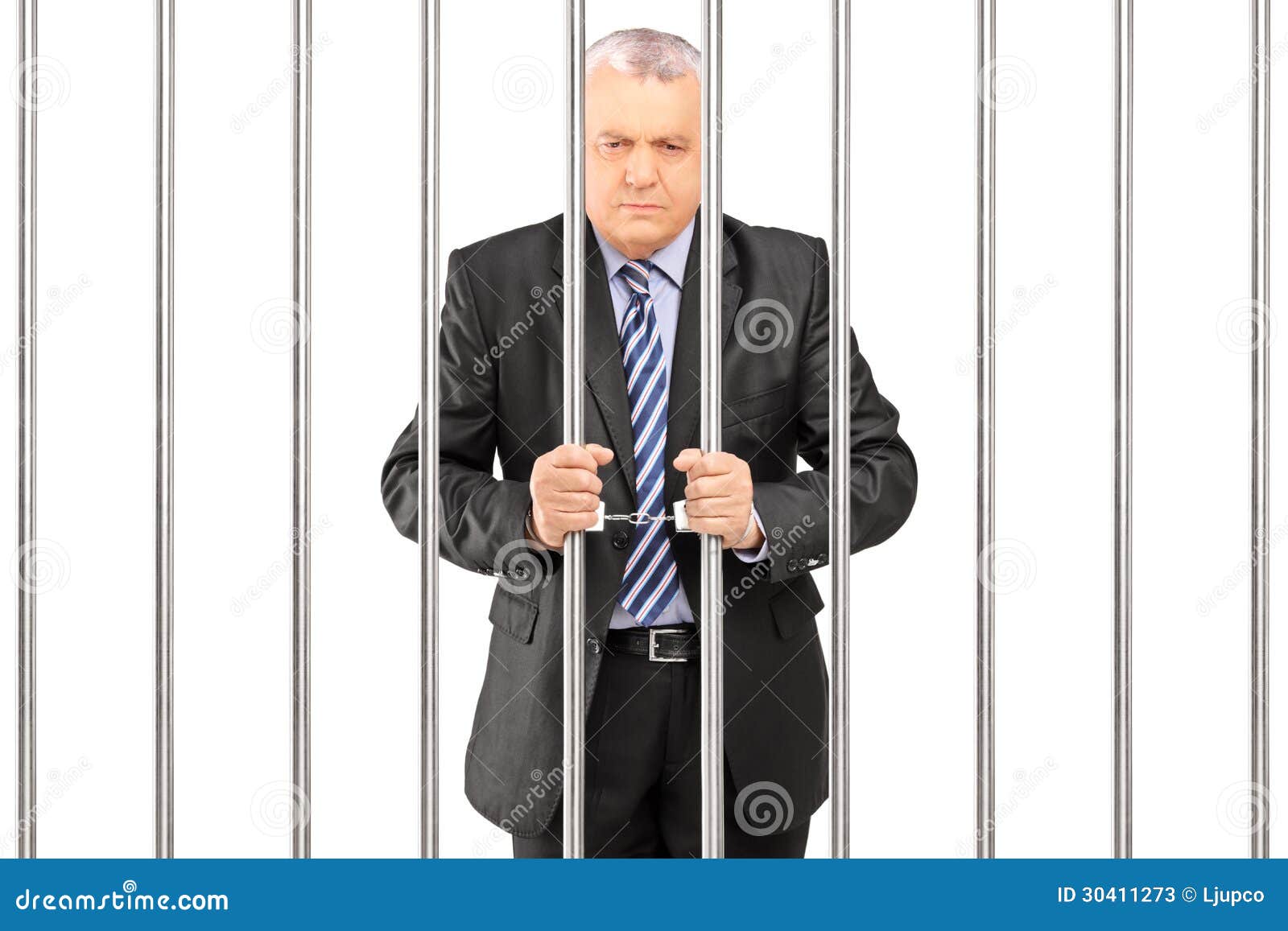 A Handcuffed Manager in Suit Posing in Jail and Holding Bars Stock ...