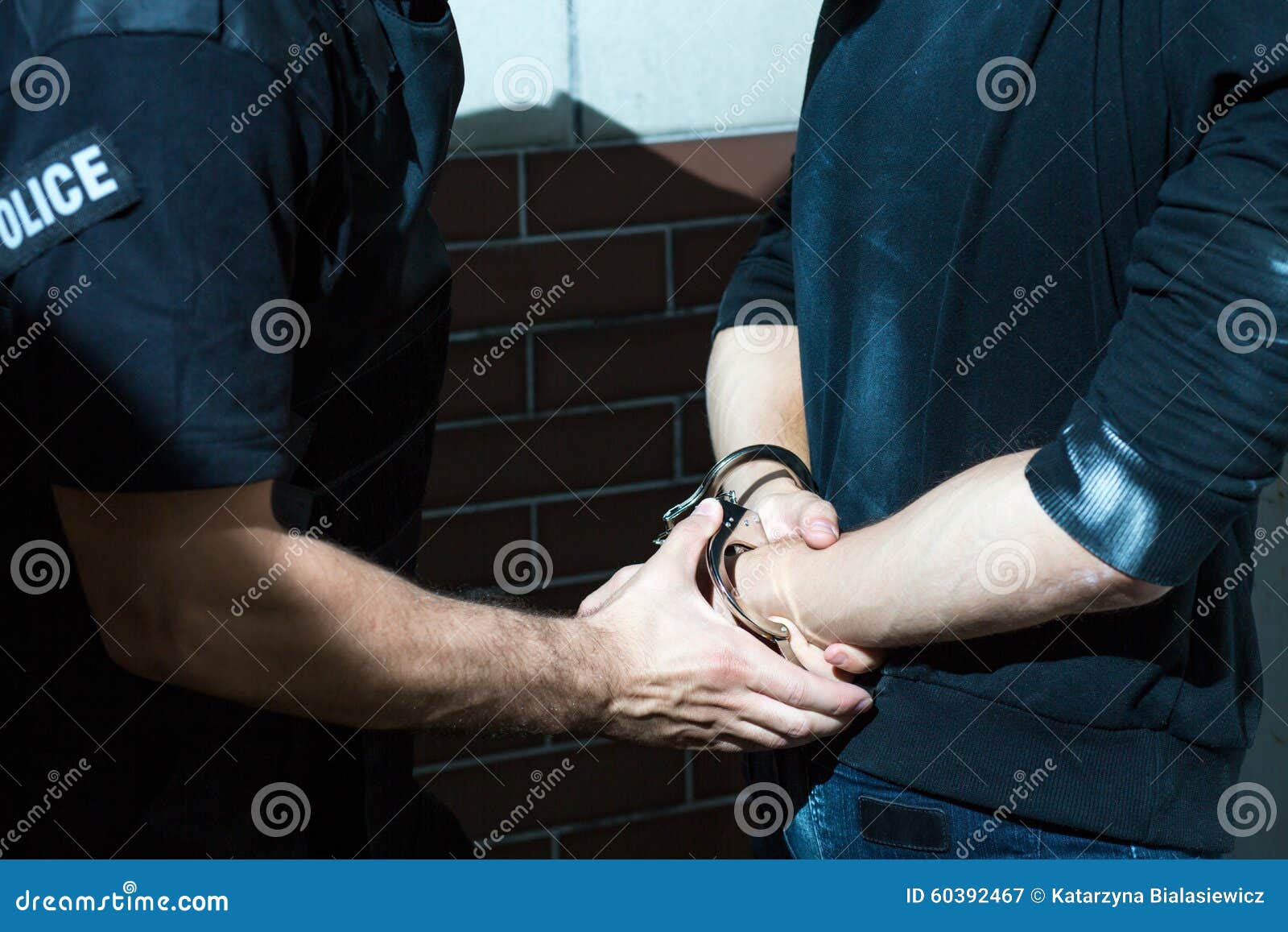 Handcuffed by a policeman stock image. Image of police - 60392467