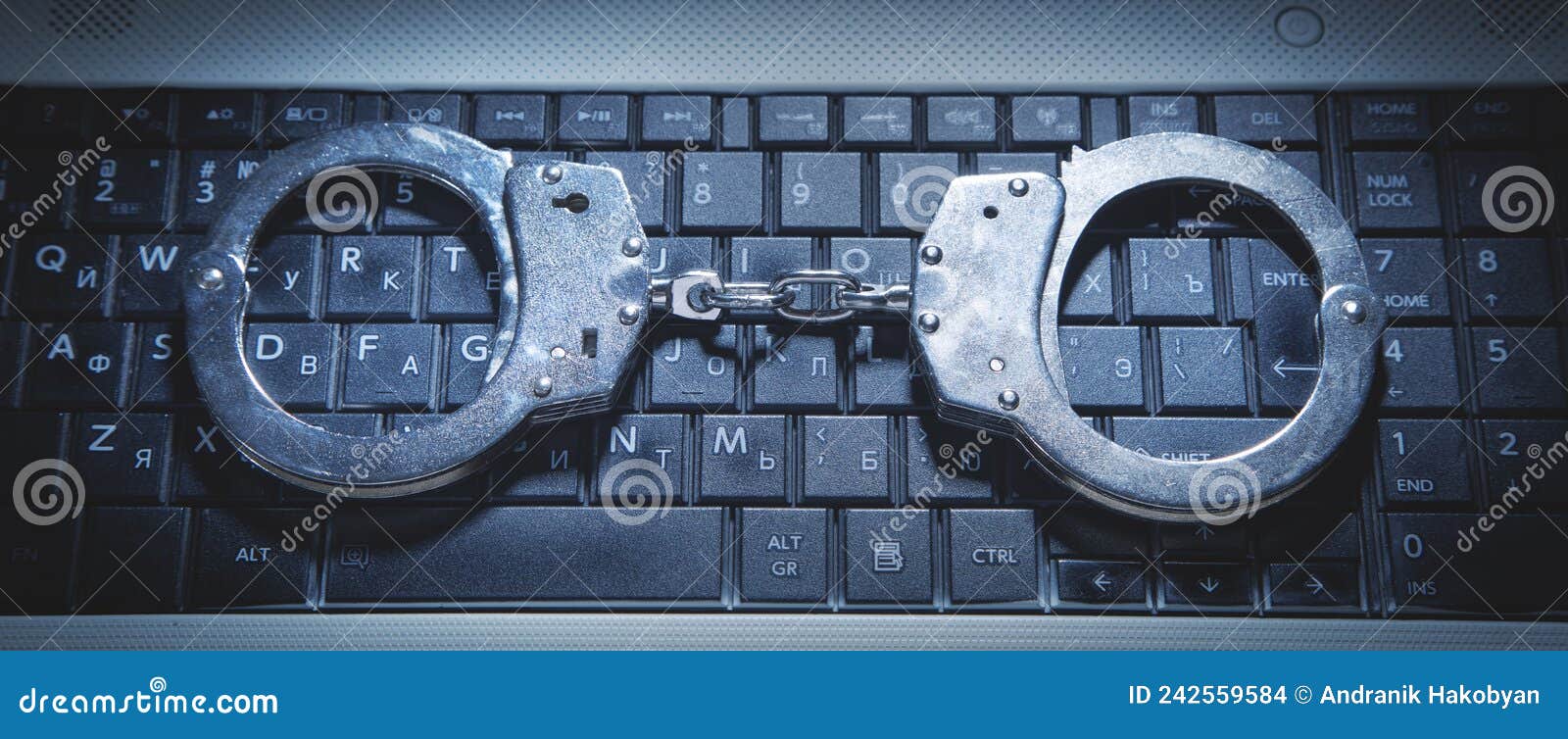 Handcuffs on the Computer Keyboard. Cyber Crime Stock Photo - Image of ...