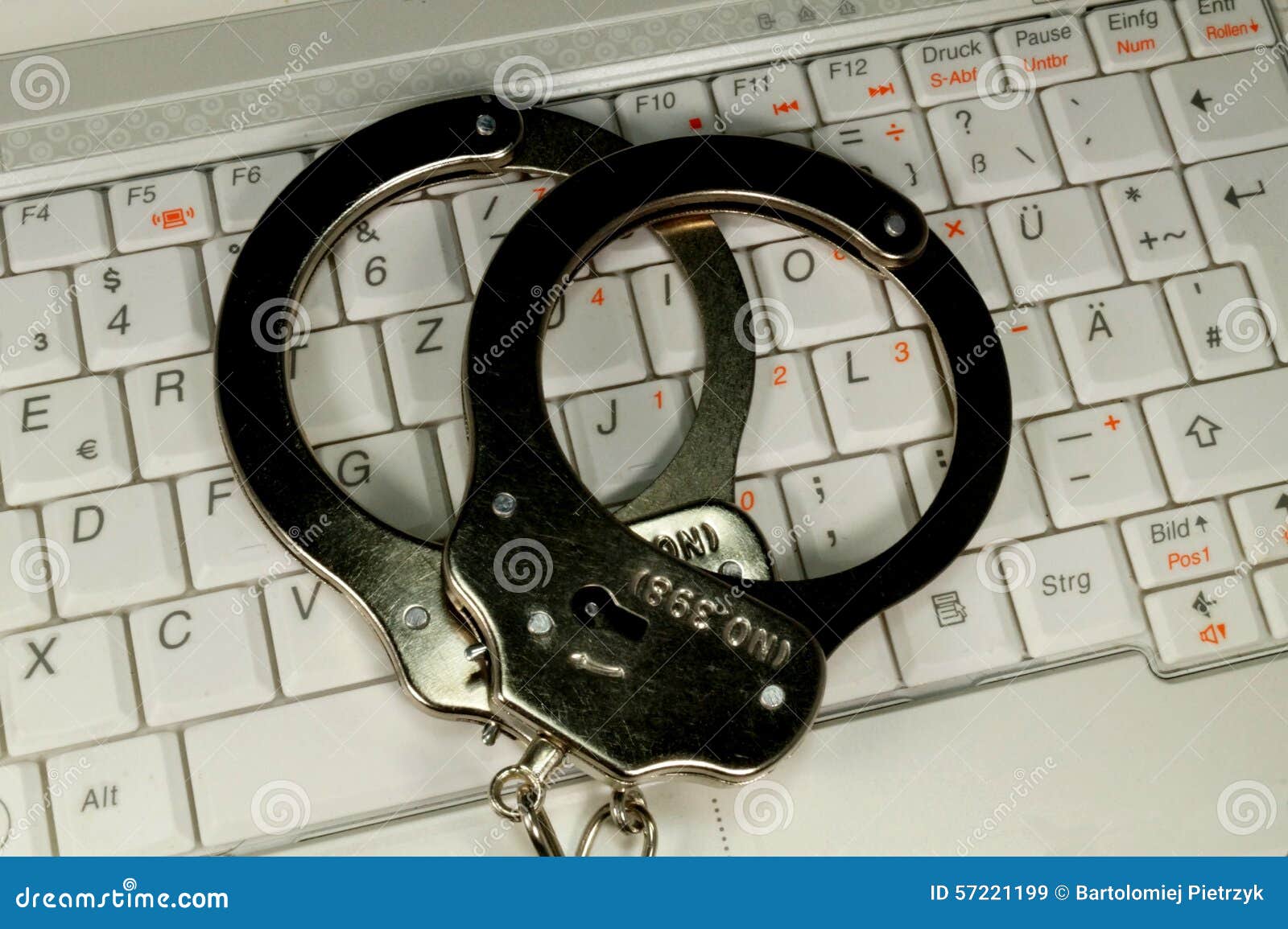 Handcuffs and Computer stock image. Image of protection - 57221199